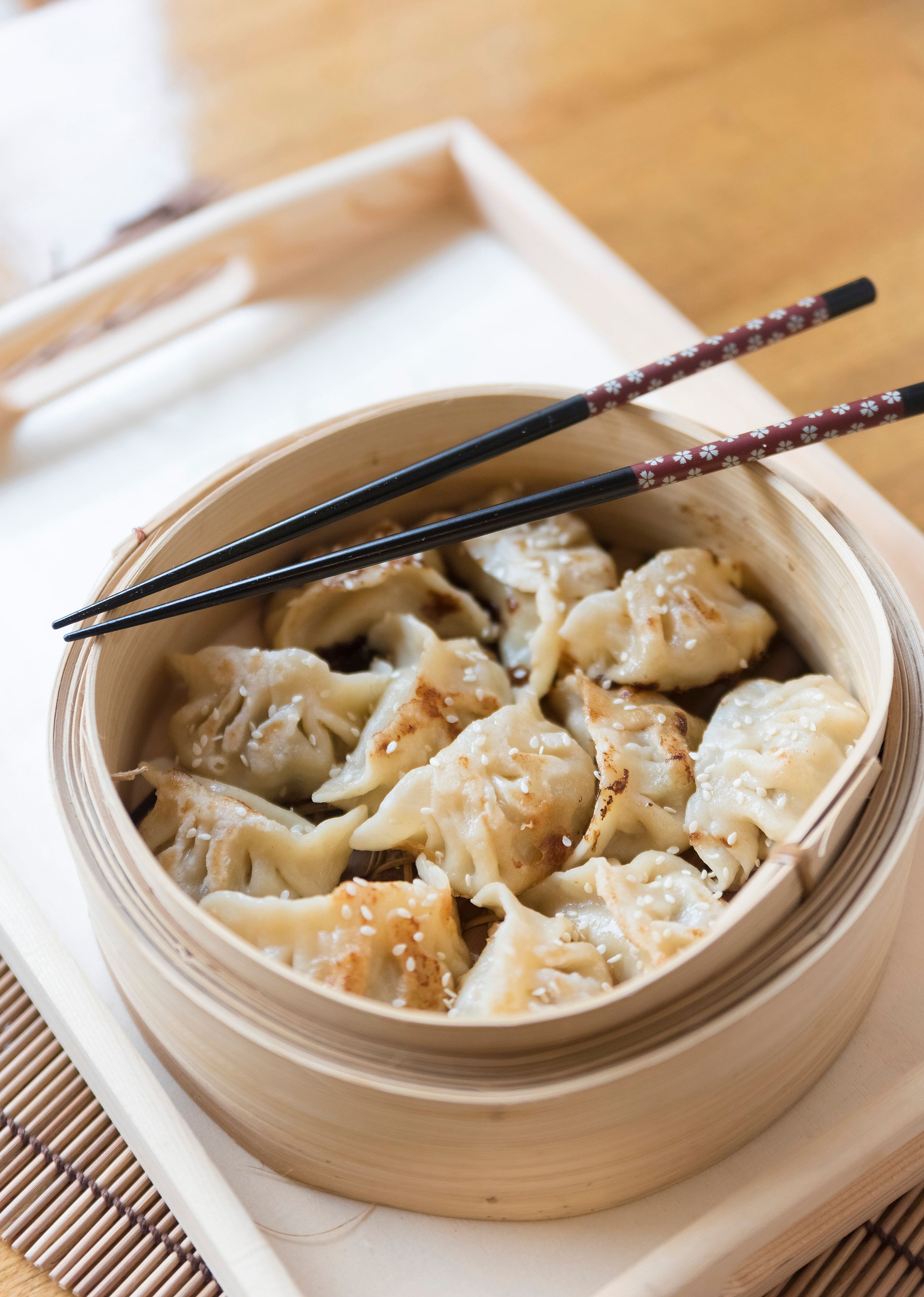 Traditional Steamed Dumplings and Chopsticks on Table · Free Stock Photo