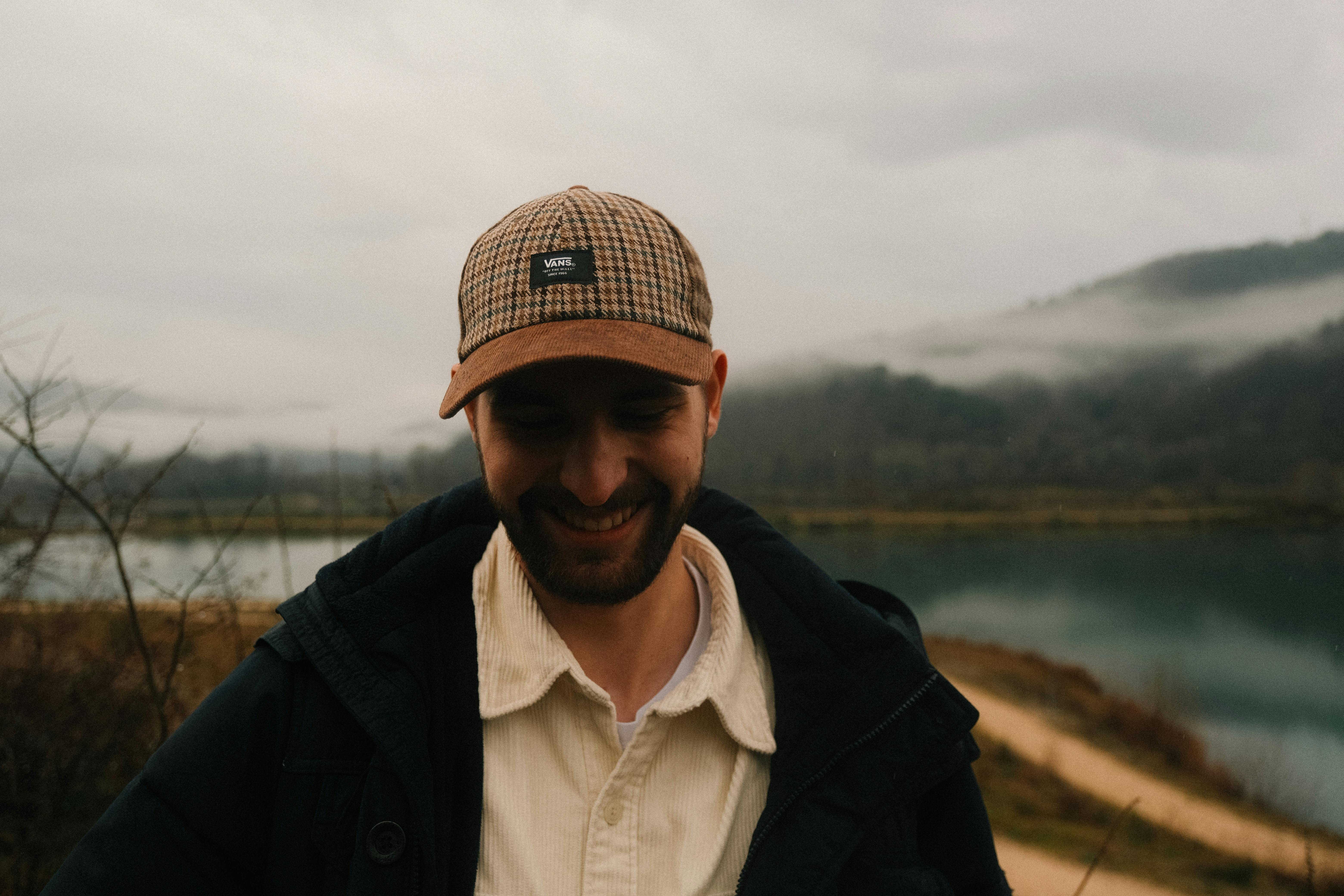 Portrait of a Man with a Cap Smiling · Free Stock Photo