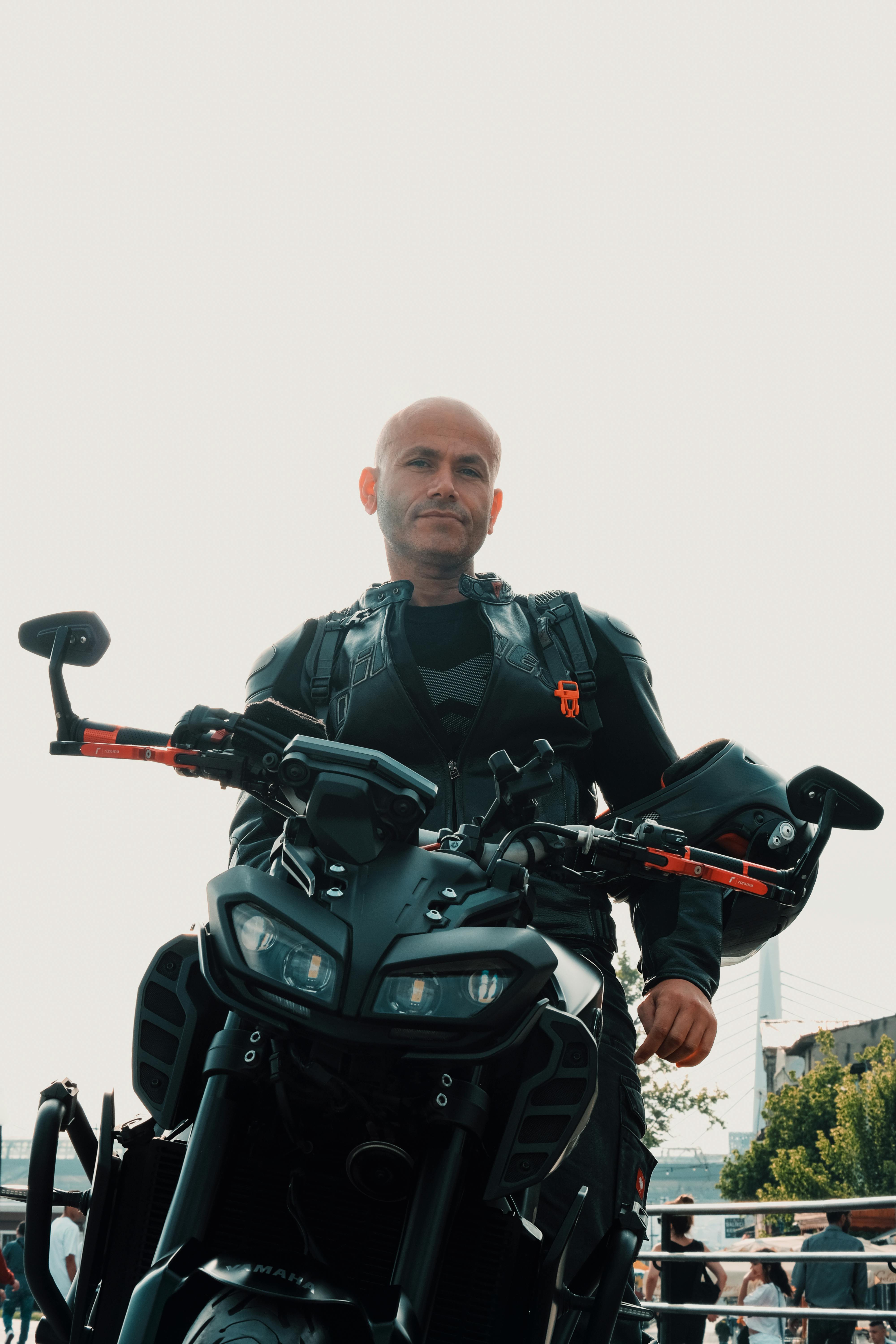 Bald Man in a Leather Jacket Standing next to His Motorcycle · Free ...