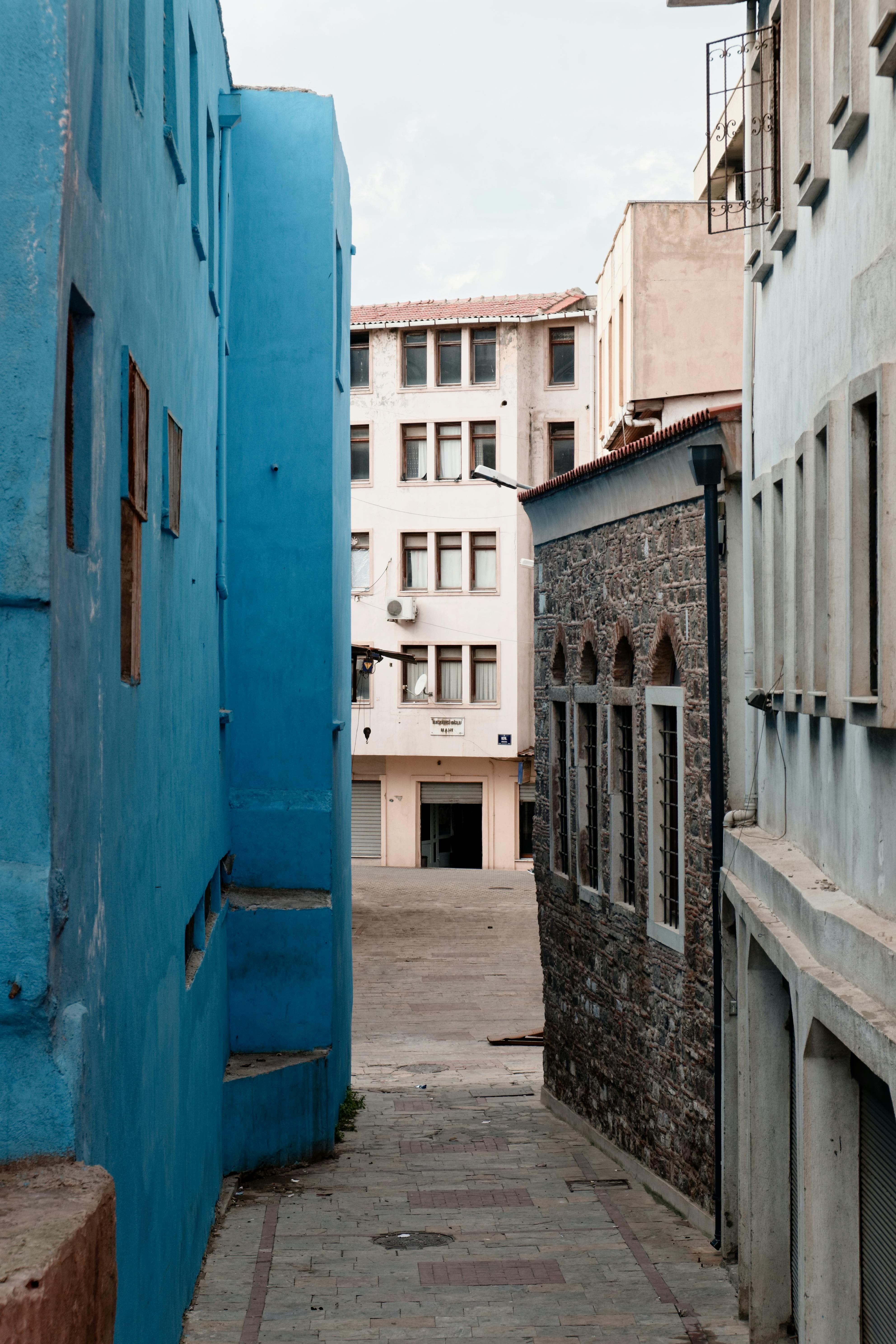 Empty Alleyway Between Shops · Free Stock Photo