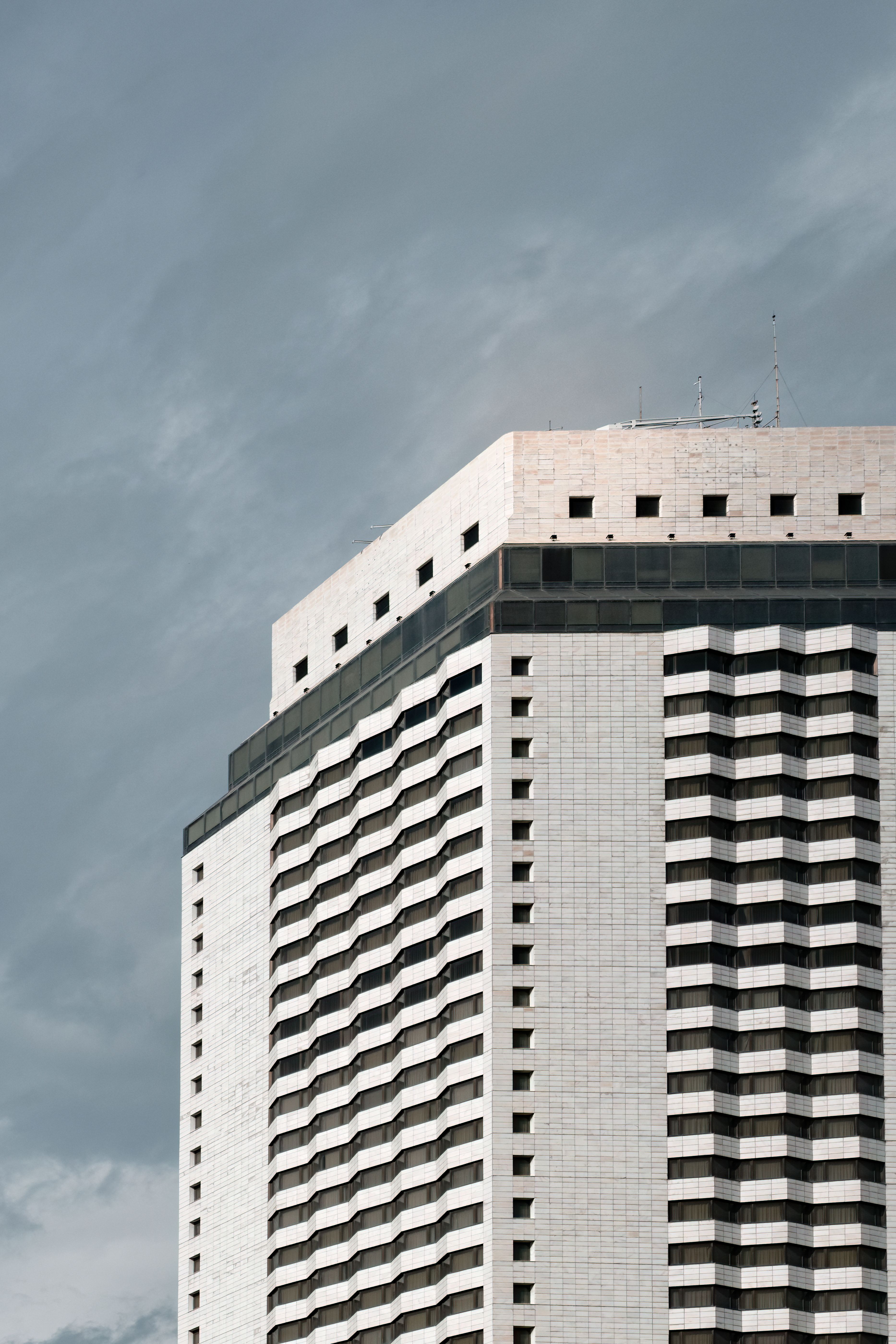 Low-Angle Shot of a High Rise Building under the Sky · Free Stock Photo