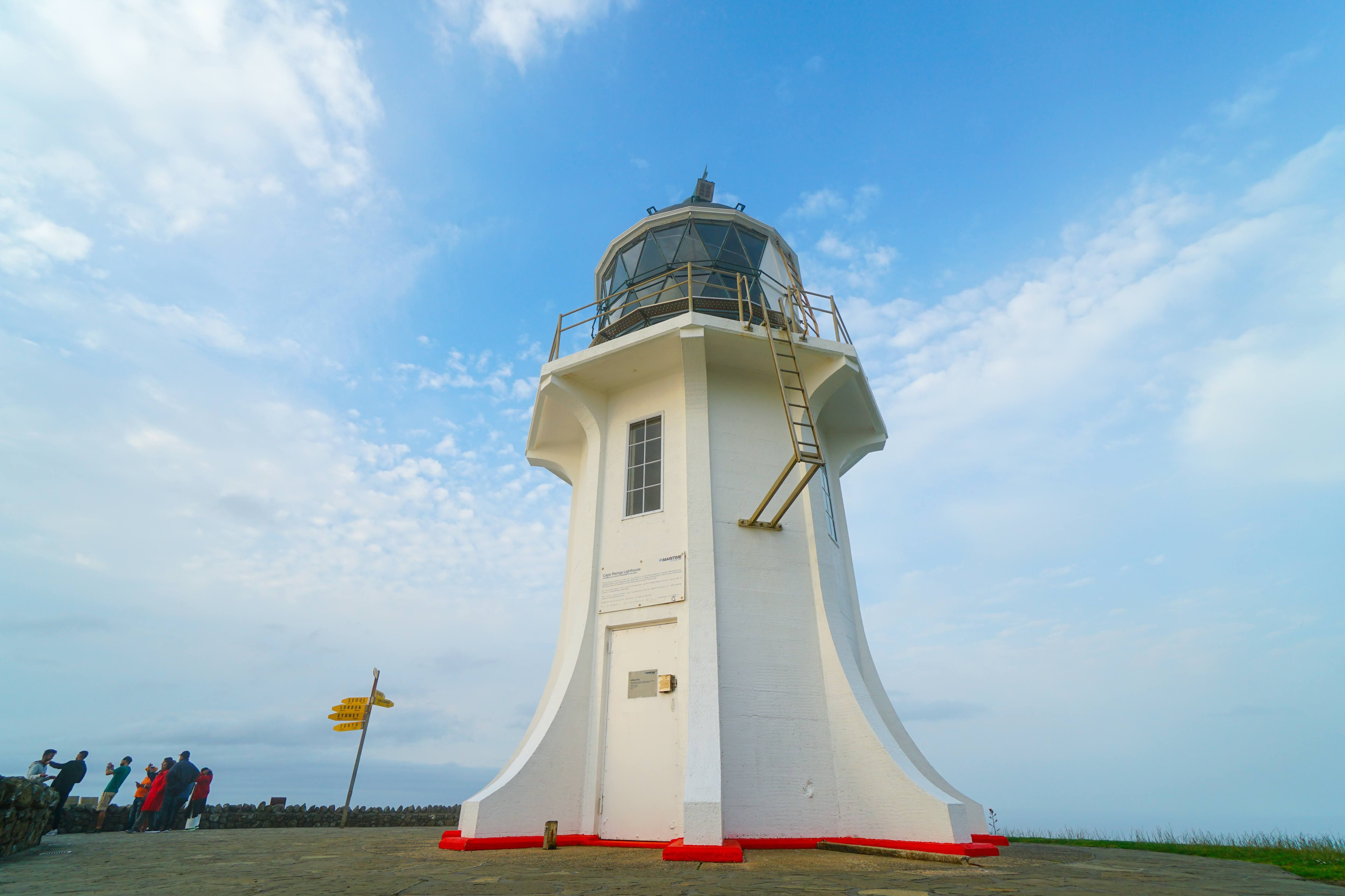 Low-Angle Shot of a Lighthouse under the Cloudy Sky · Free Stock Photo