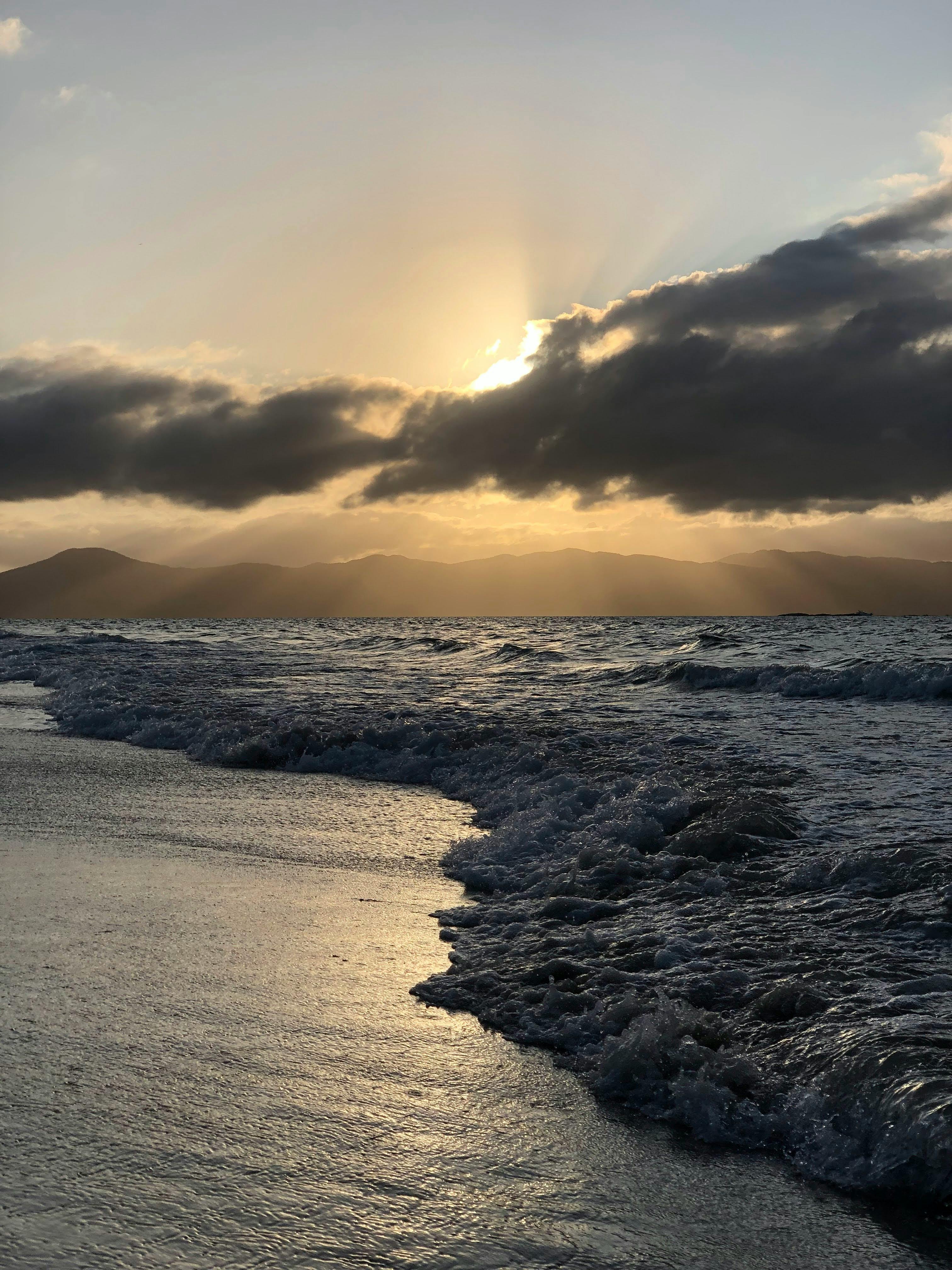 Child Running on Sea Shore at Sunset · Free Stock Photo