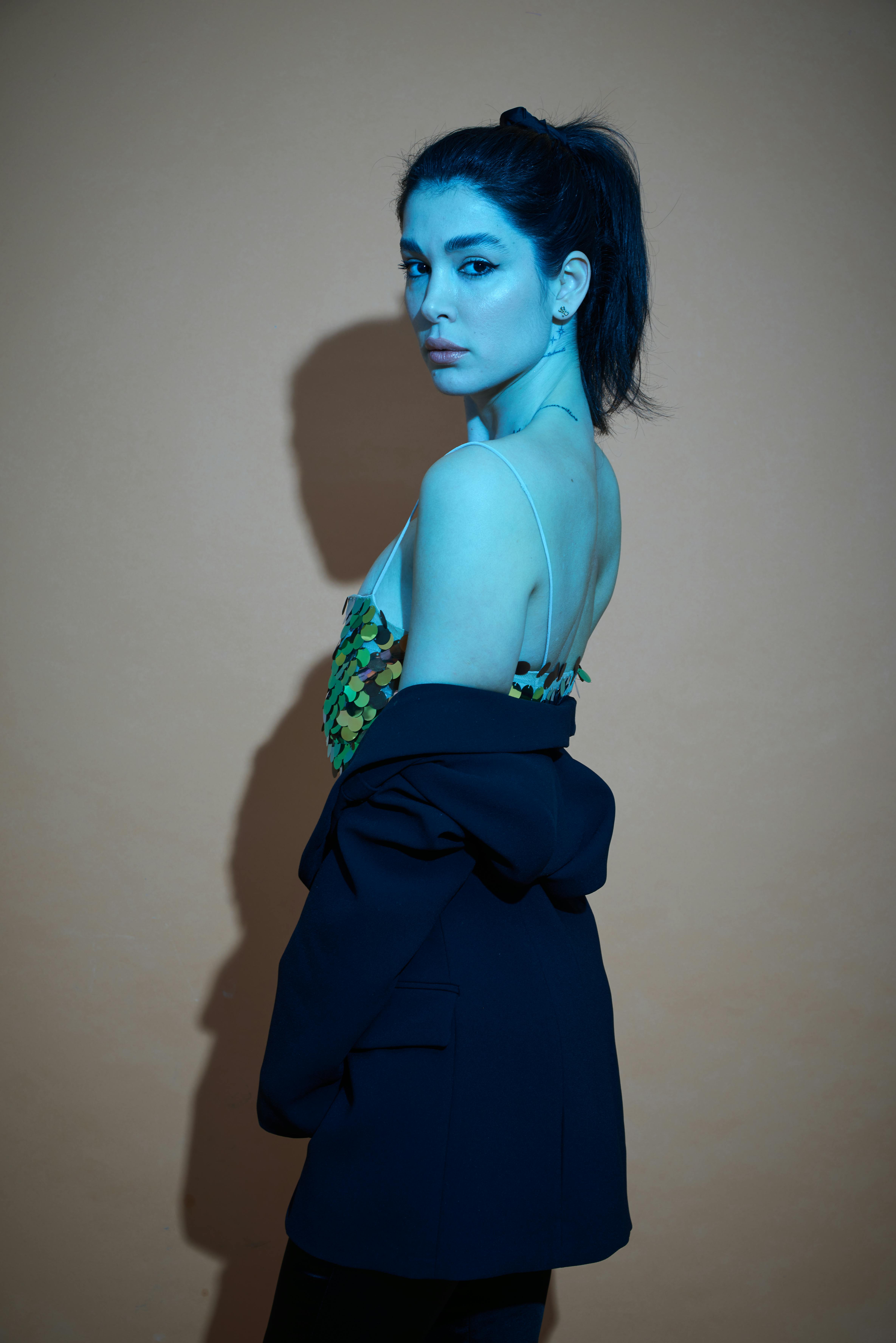 Portrait of a Woman Looking Over her Shoulder · Free Stock Photo