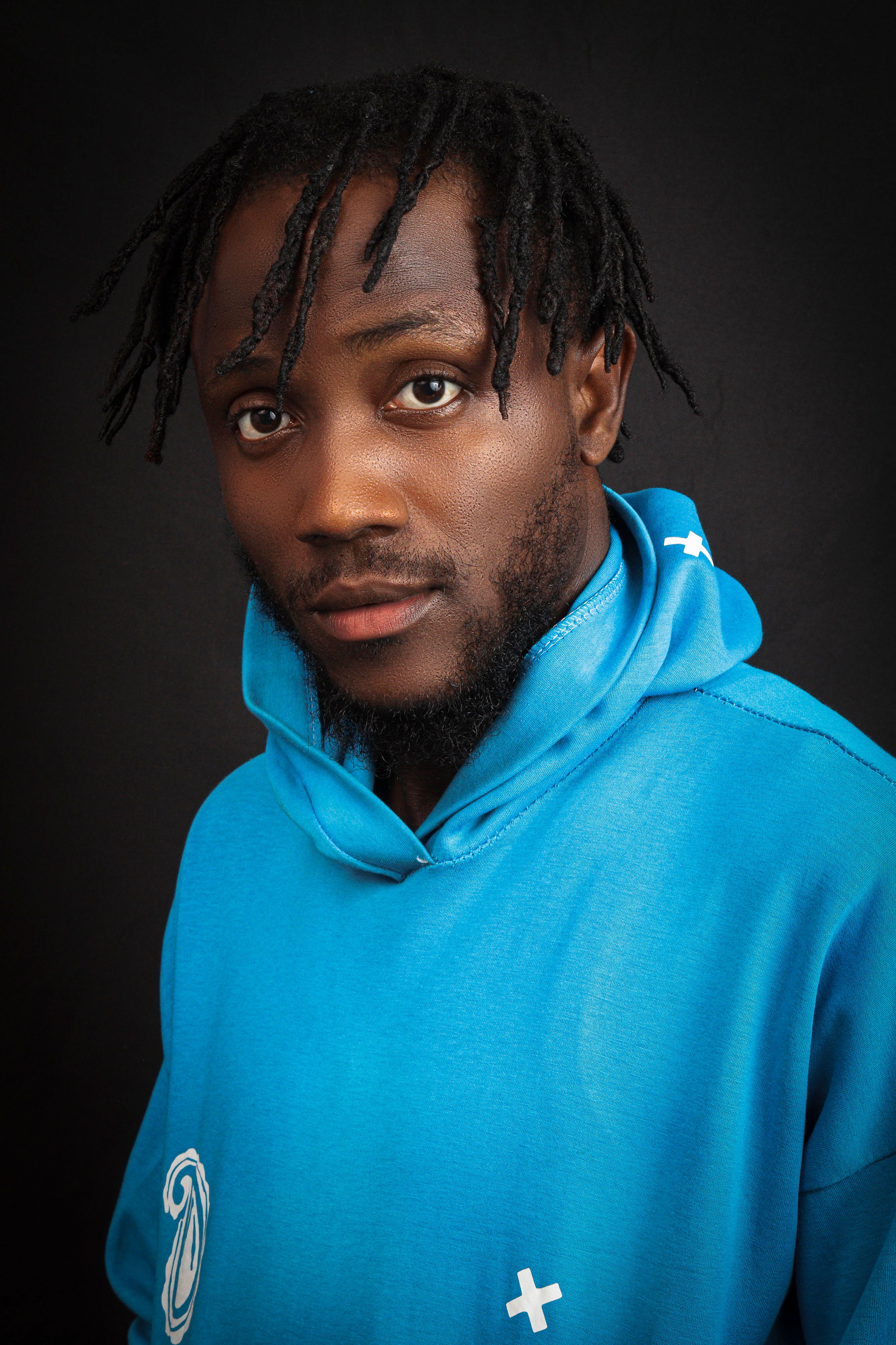 Portrait of Man with Dreadlocks in Hoodie · Free Stock Photo
