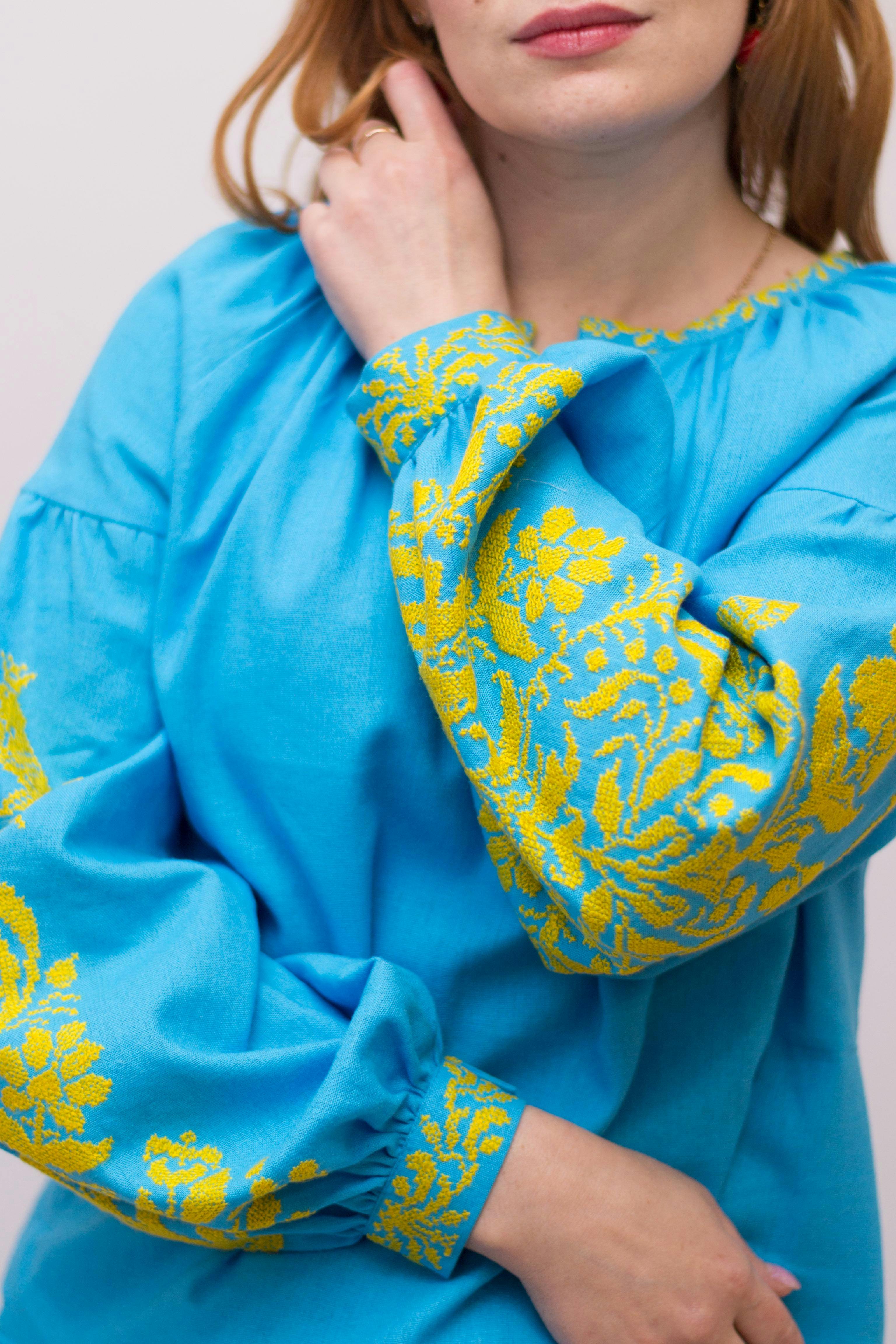 Woman in Blue Dress and Embroidered Blouse · Free Stock Photo