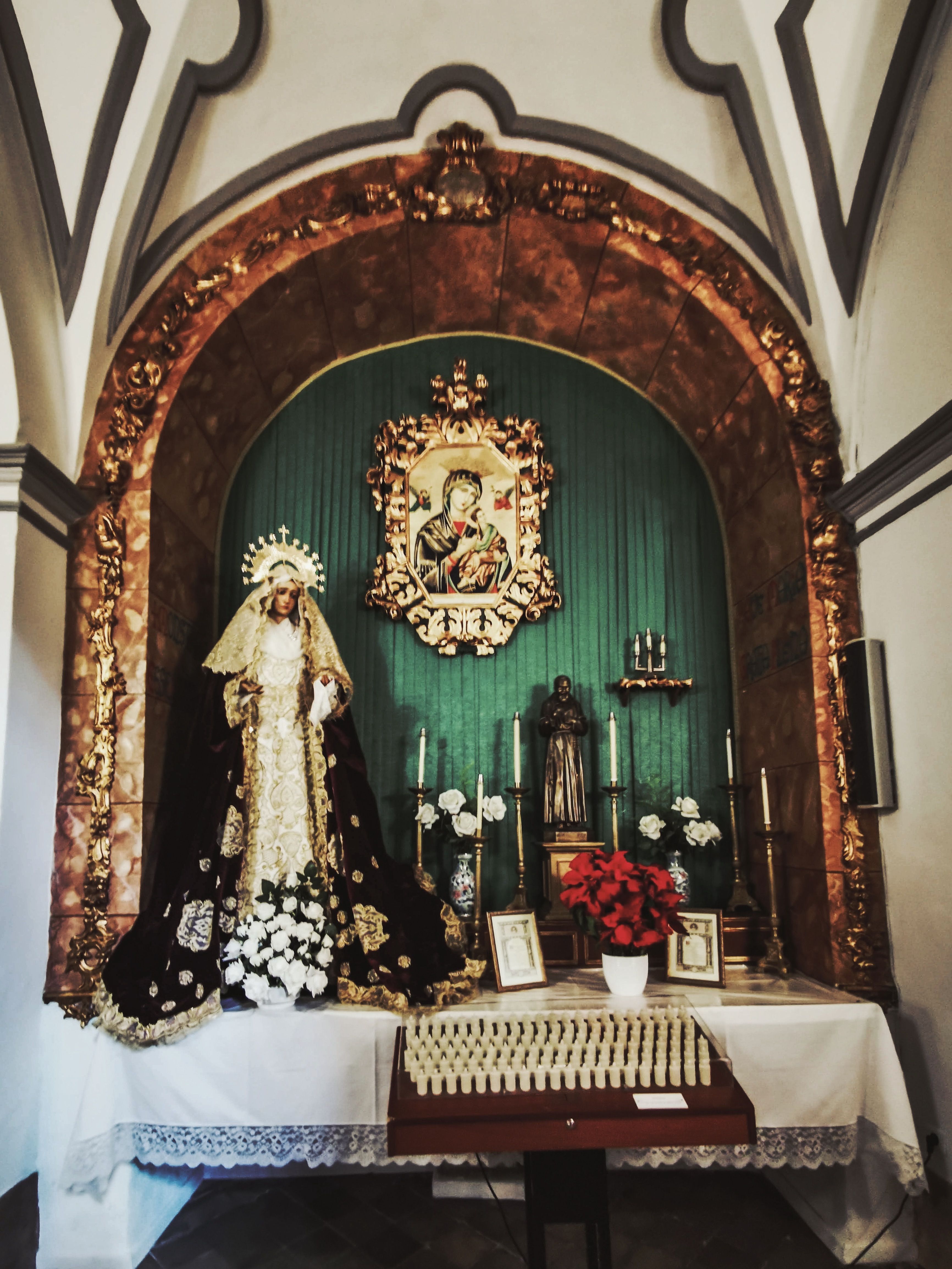An Altar Decorated with Flowers and Wreaths · Free Stock Photo