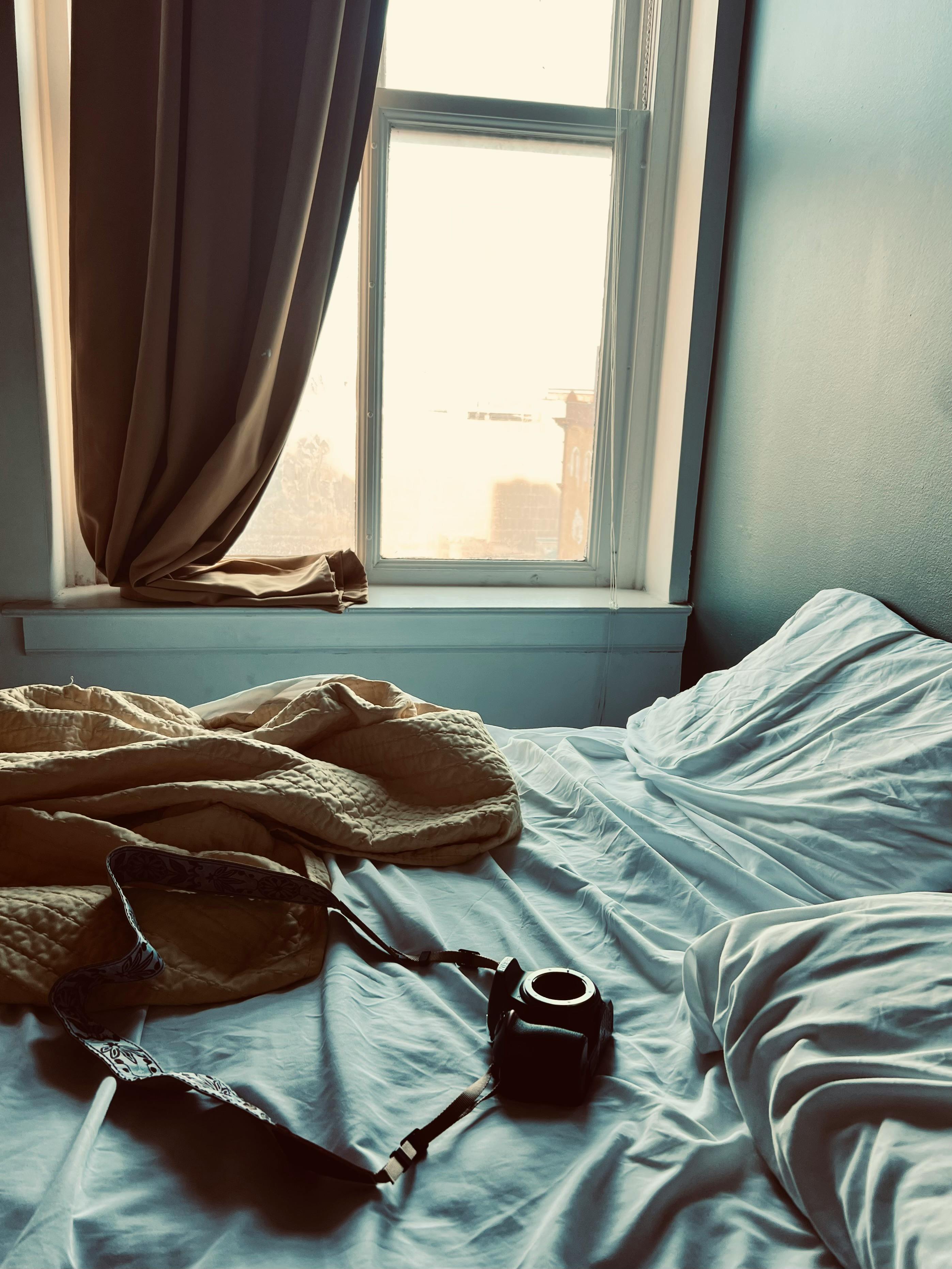 Camera on Bed · Free Stock Photo