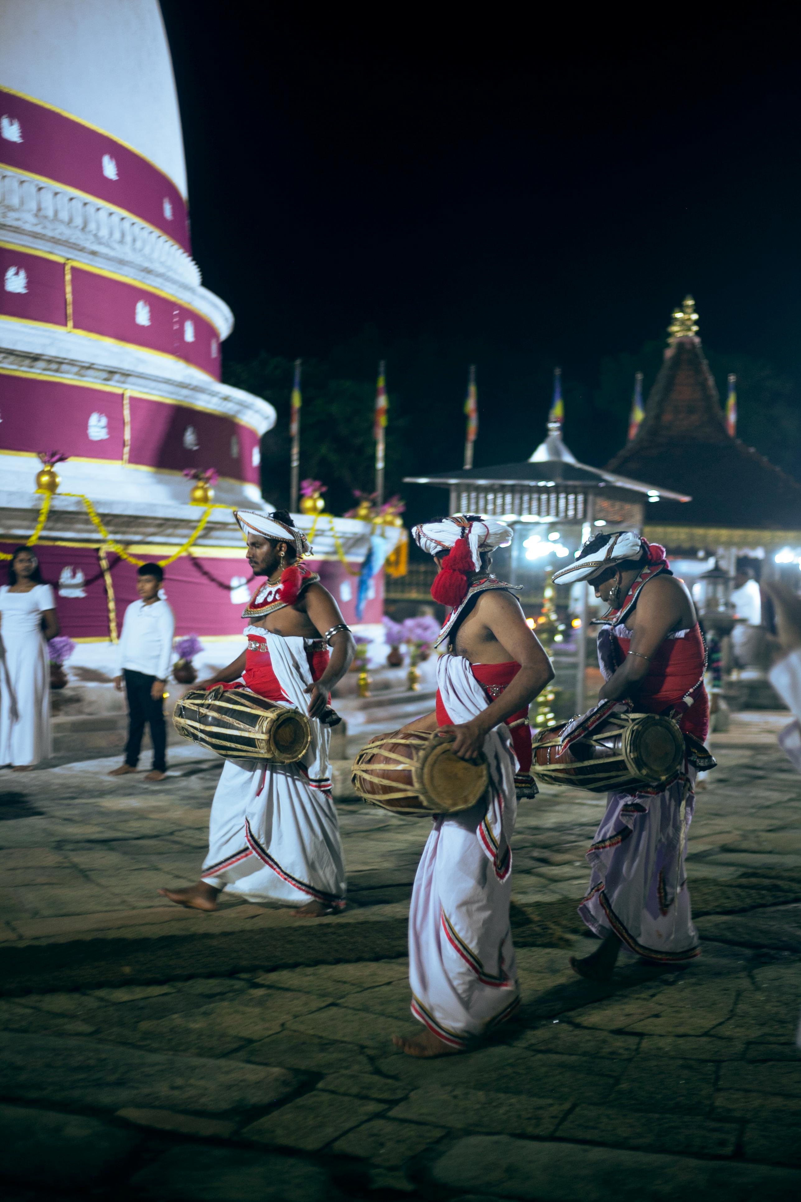 Silhouette of People on Stilts and Playing Music · Free Stock Photo