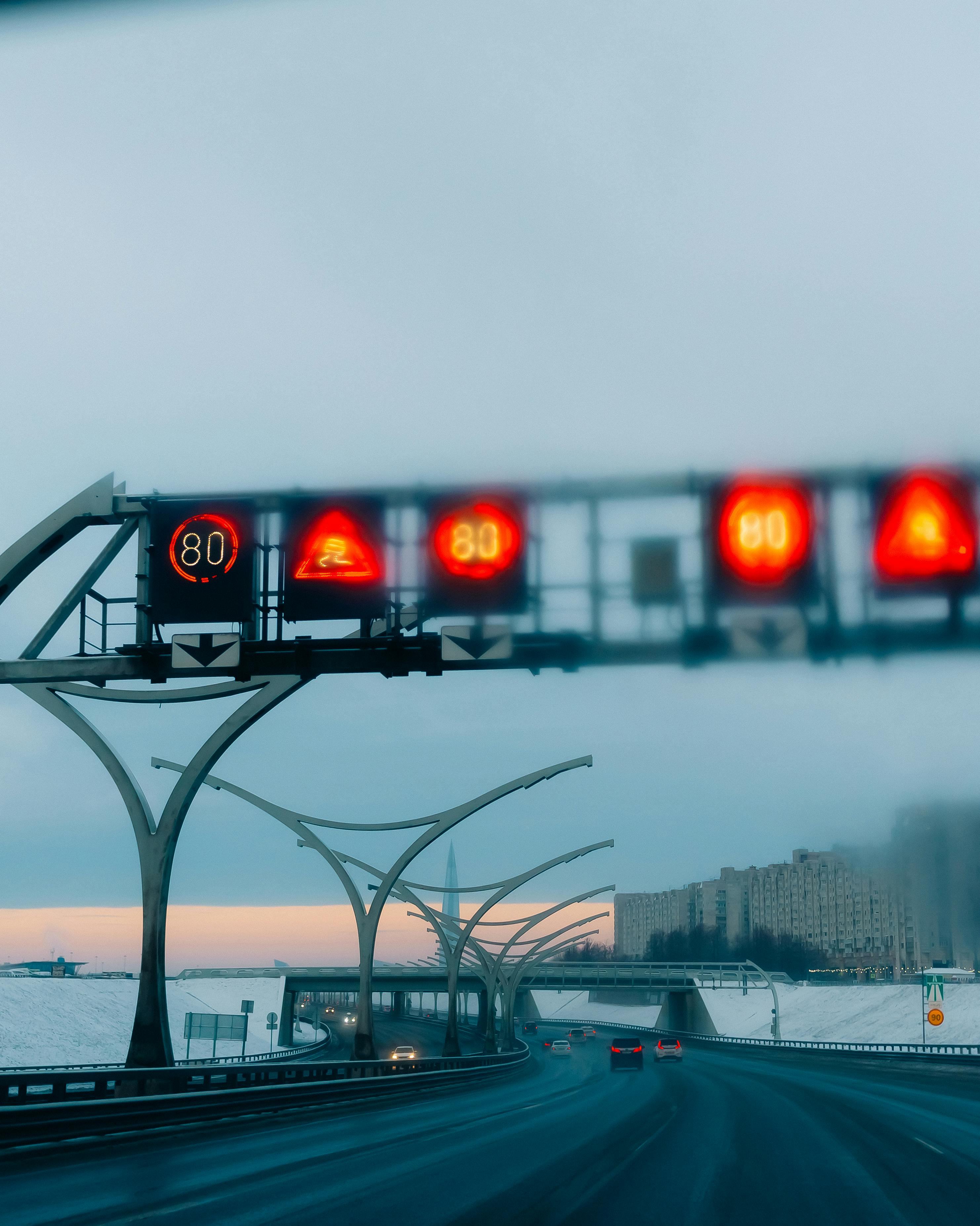 Illuminated Road Signs on Highway · Free Stock Photo