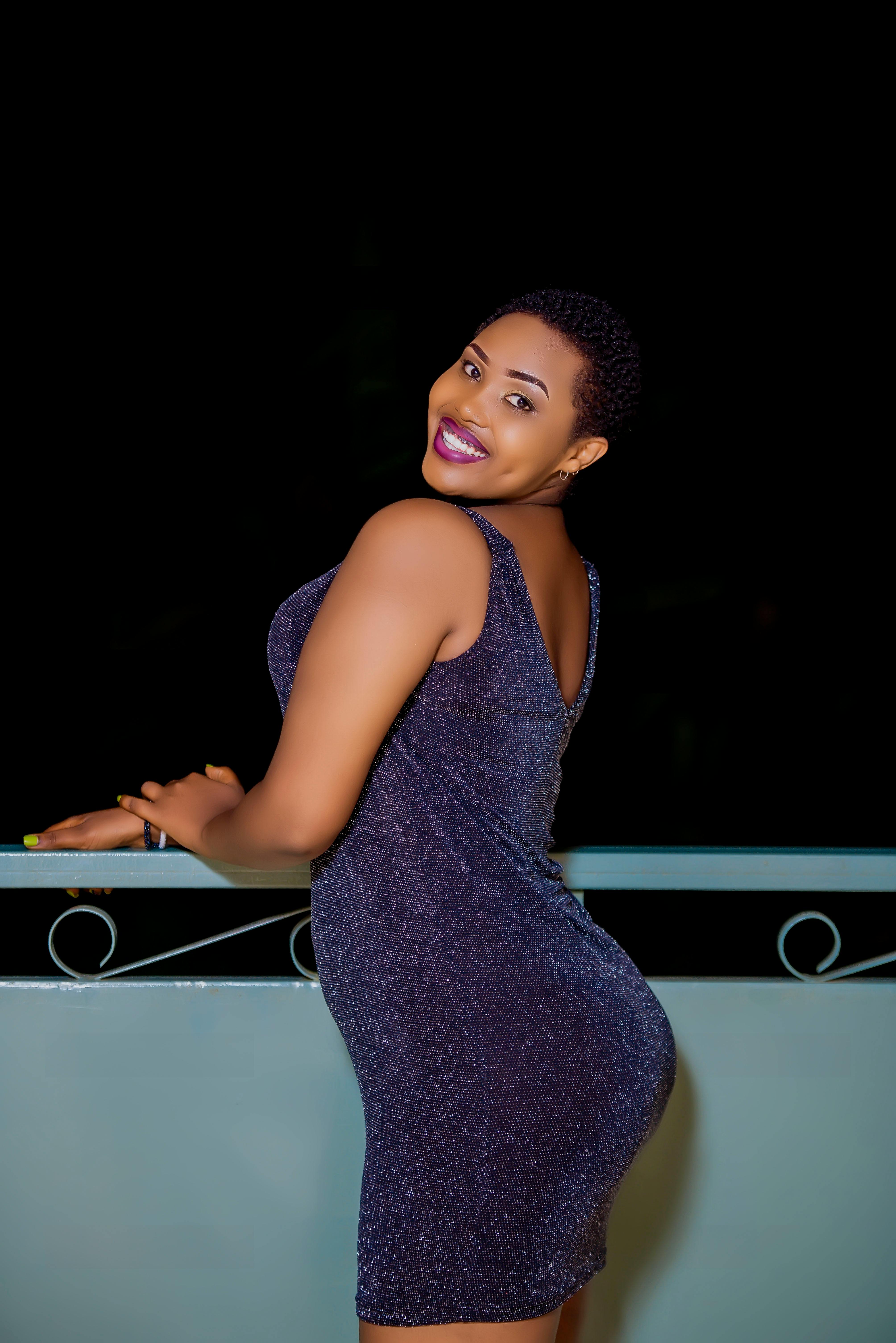 Woman Wearing Shine Clothing Posing · Free Stock Photo