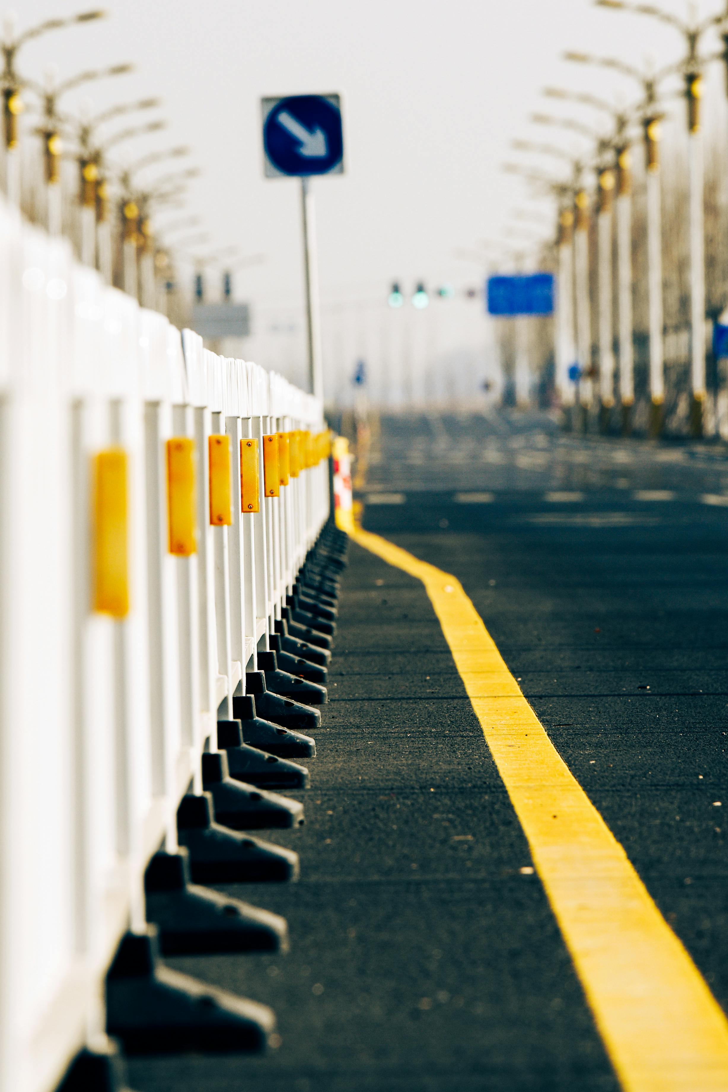 Yellow Line Stretching along a Row of Construction Barriers · Free ...