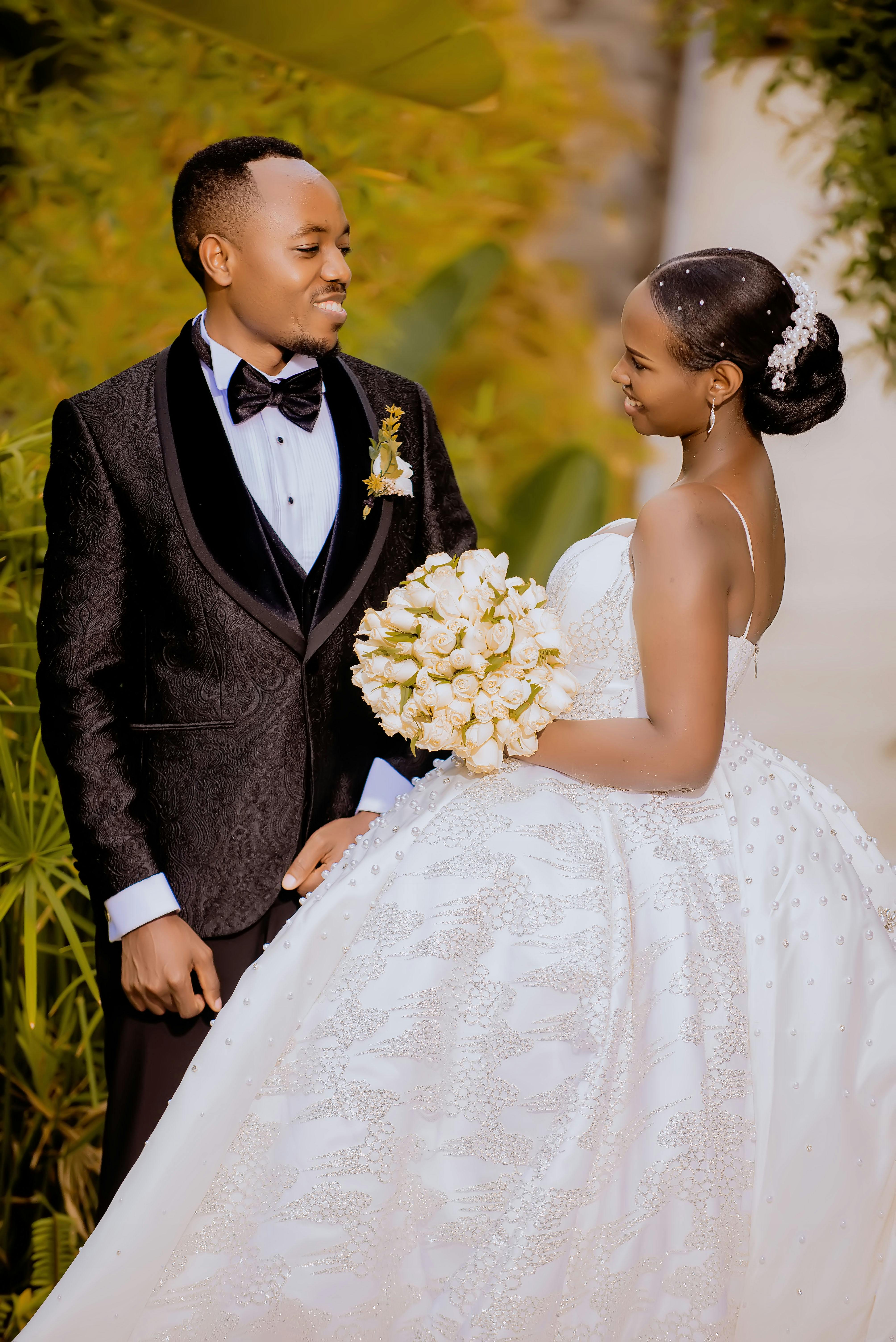 Bride and Groom Standing Beside Flower Decoration · Free Stock Photo