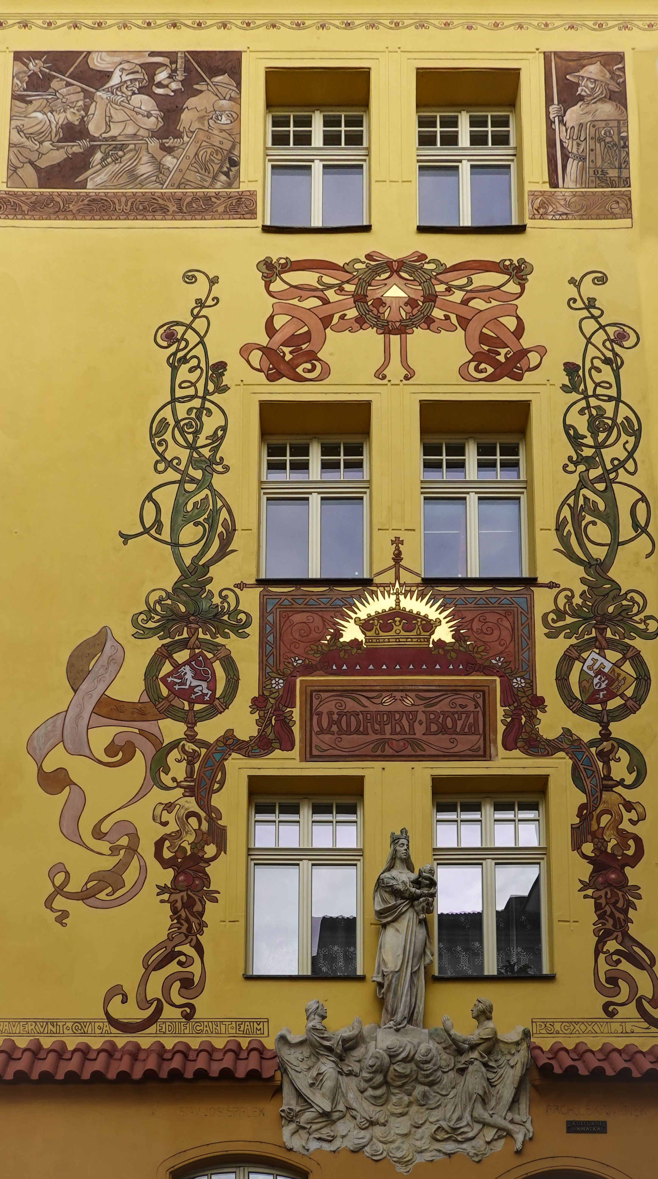 Murals and Sculptures on a Yellow Wall · Free Stock Photo