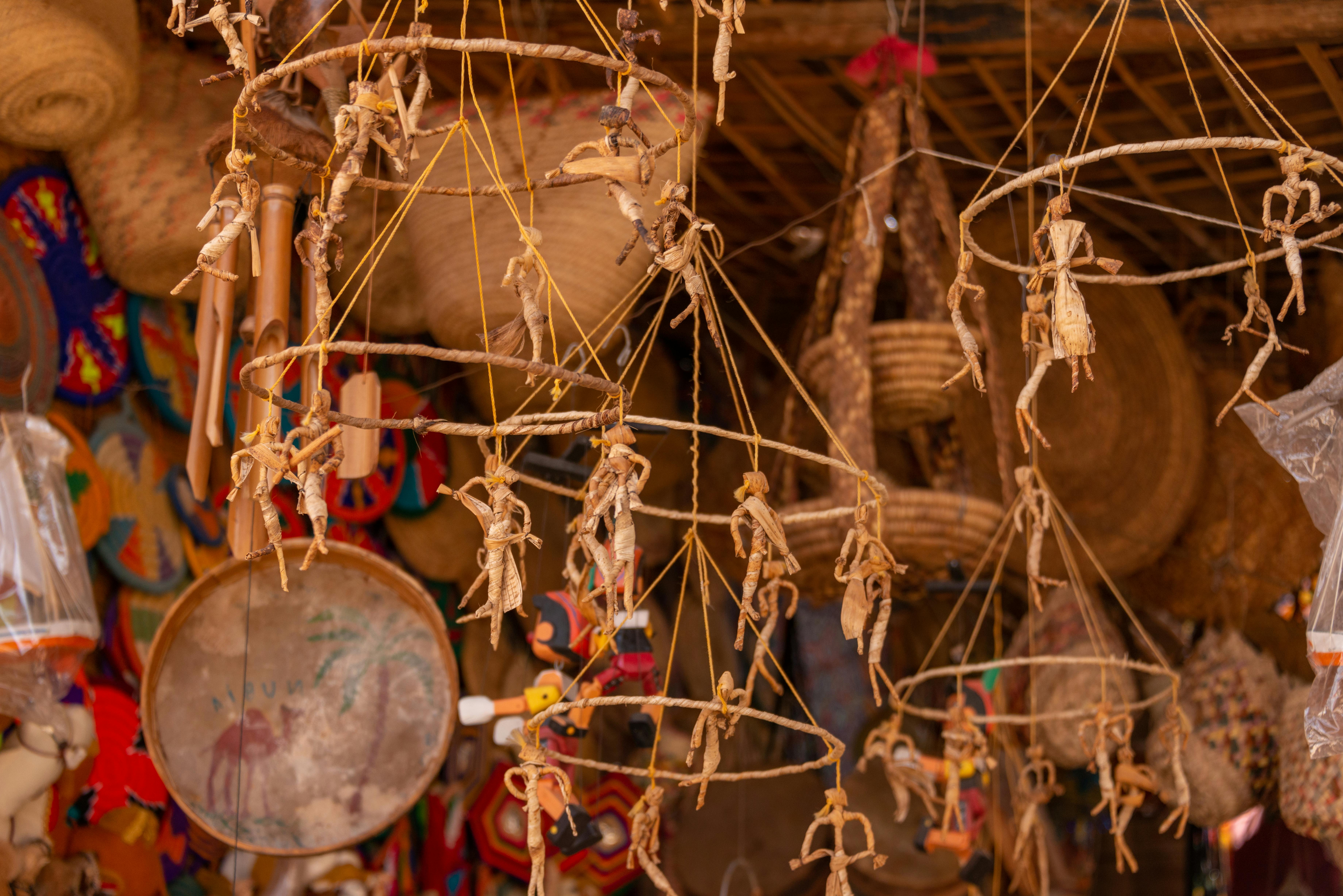 Closeup of Hanging Traditional Craft Objects · Free Stock Photo