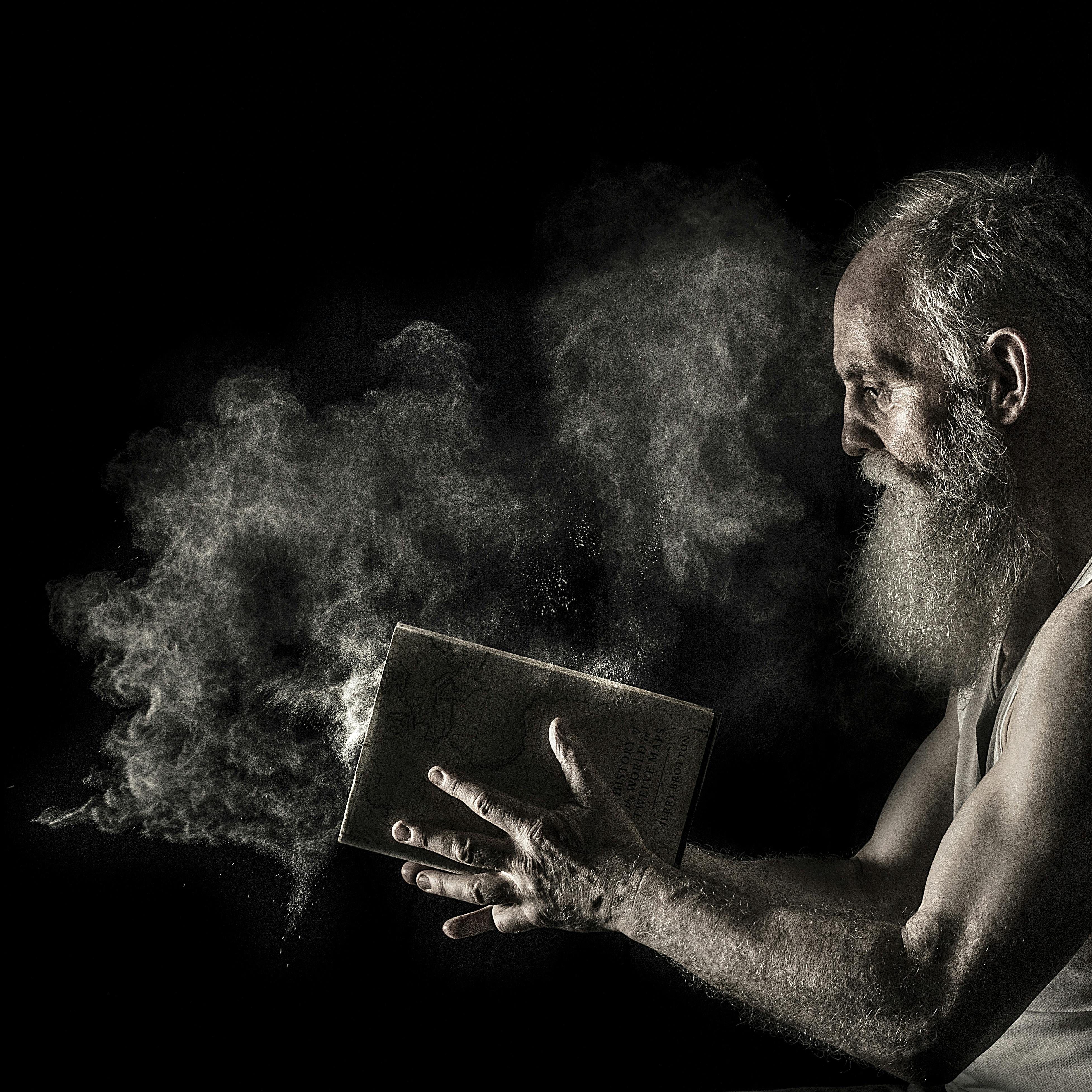Man Slamming Book · Free Stock Photo