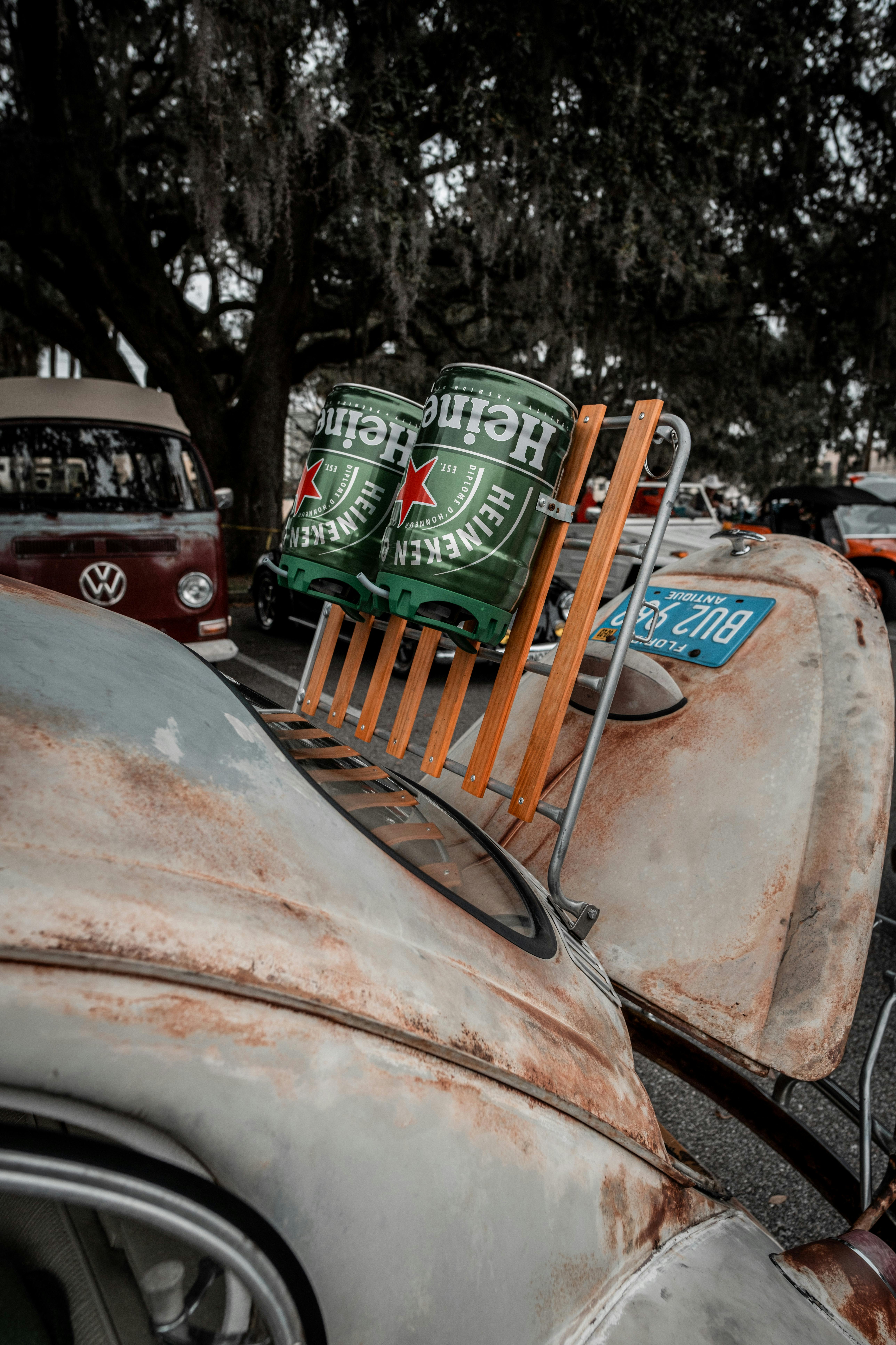 Green Beer Kegs Fitted on an Open Trunk of a Rusty Volkswagen Beetle ...