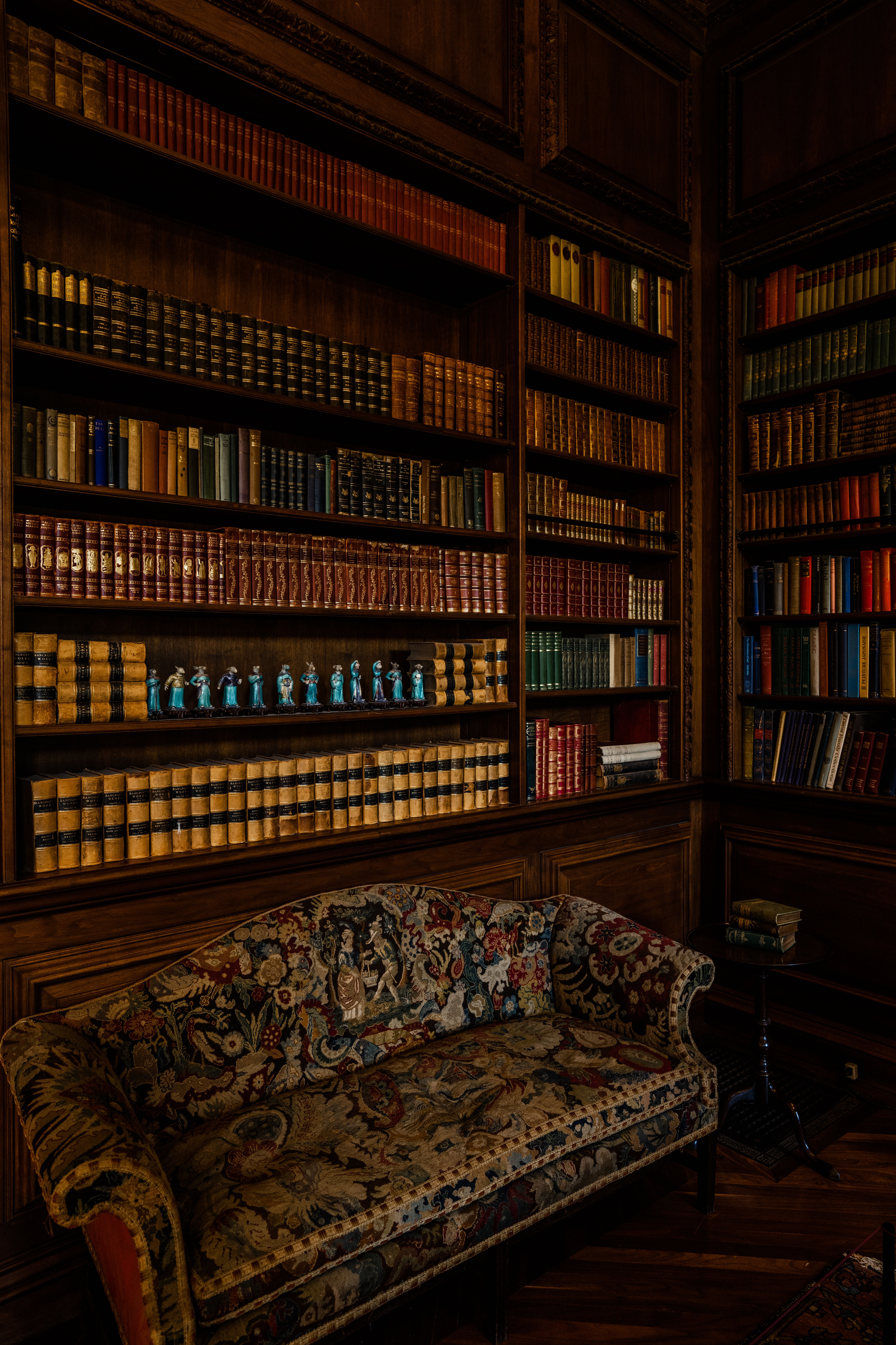 Books on Shelves behind Couch · Free Stock Photo