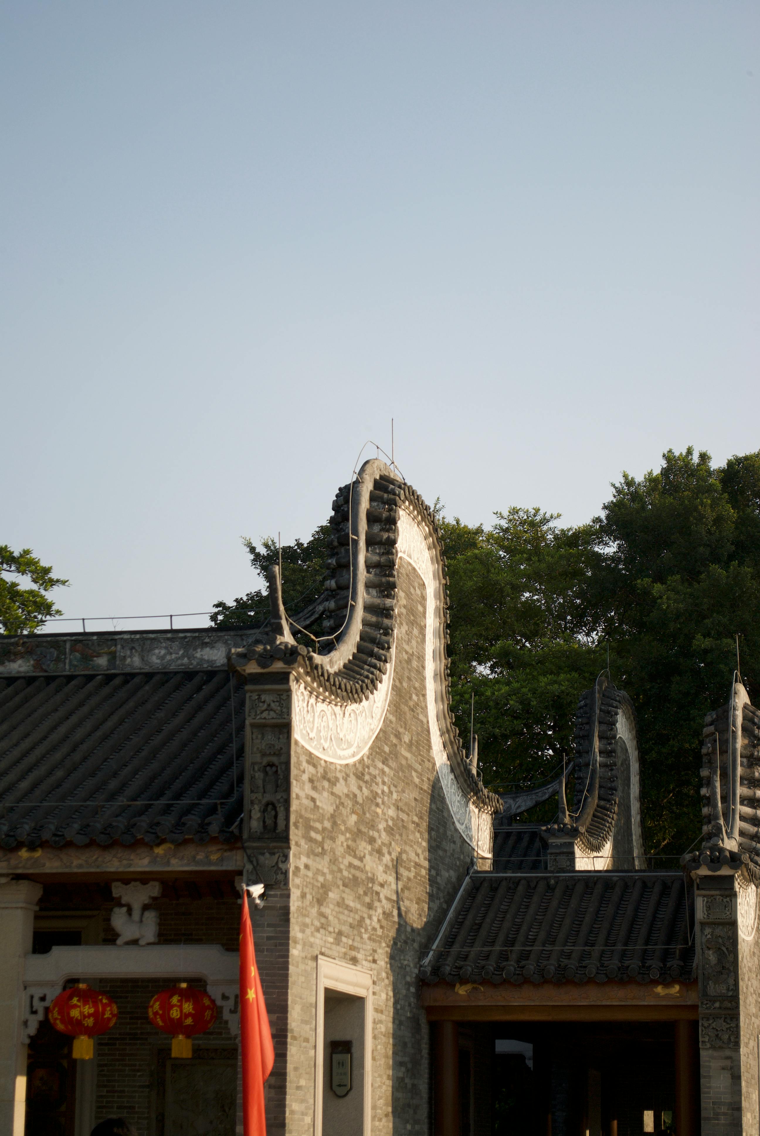 Traditional Buildings Rooftops against Blue Sky · Free Stock Photo