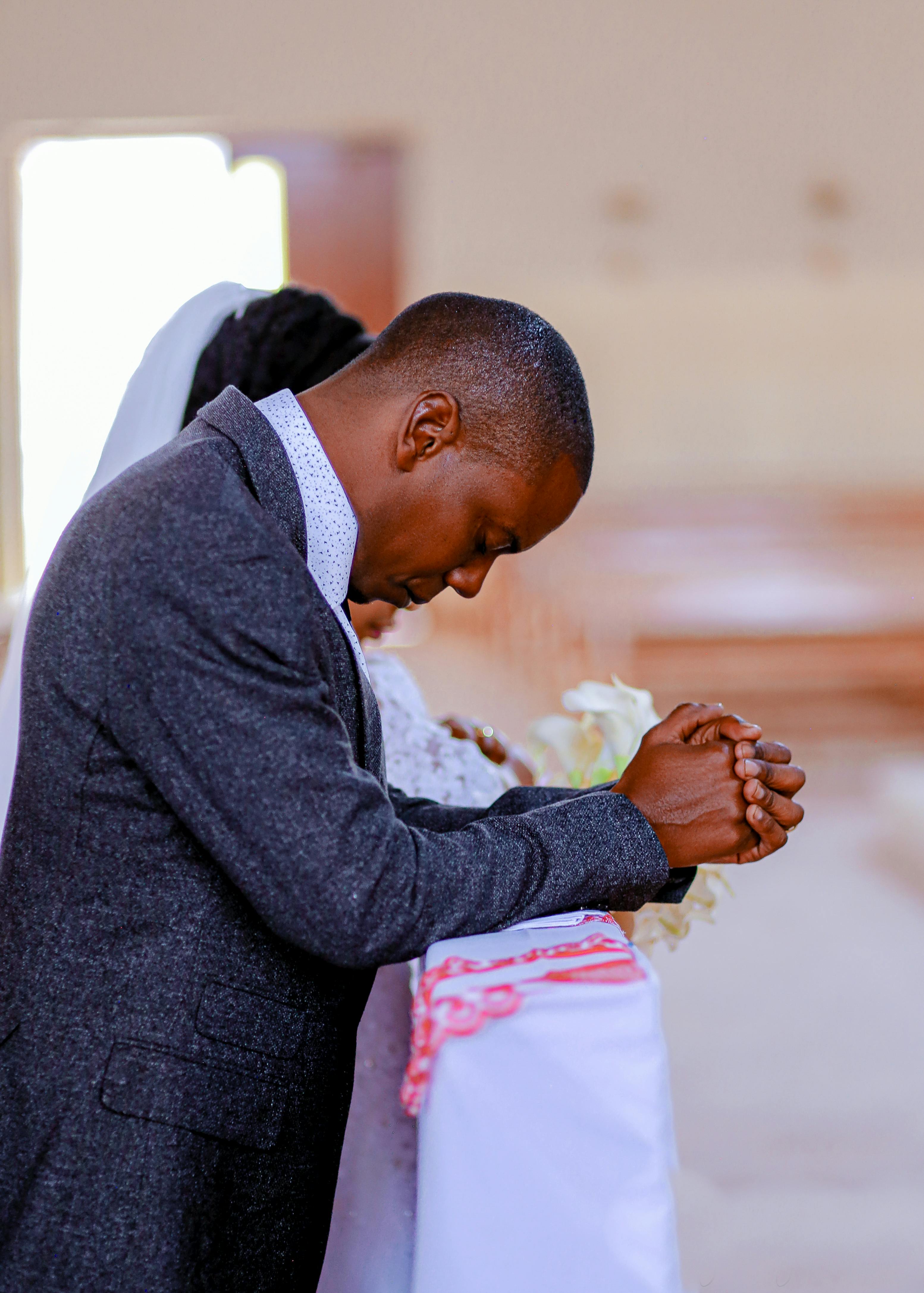 Newlywed Couple Kneeling in Church · Free Stock Photo