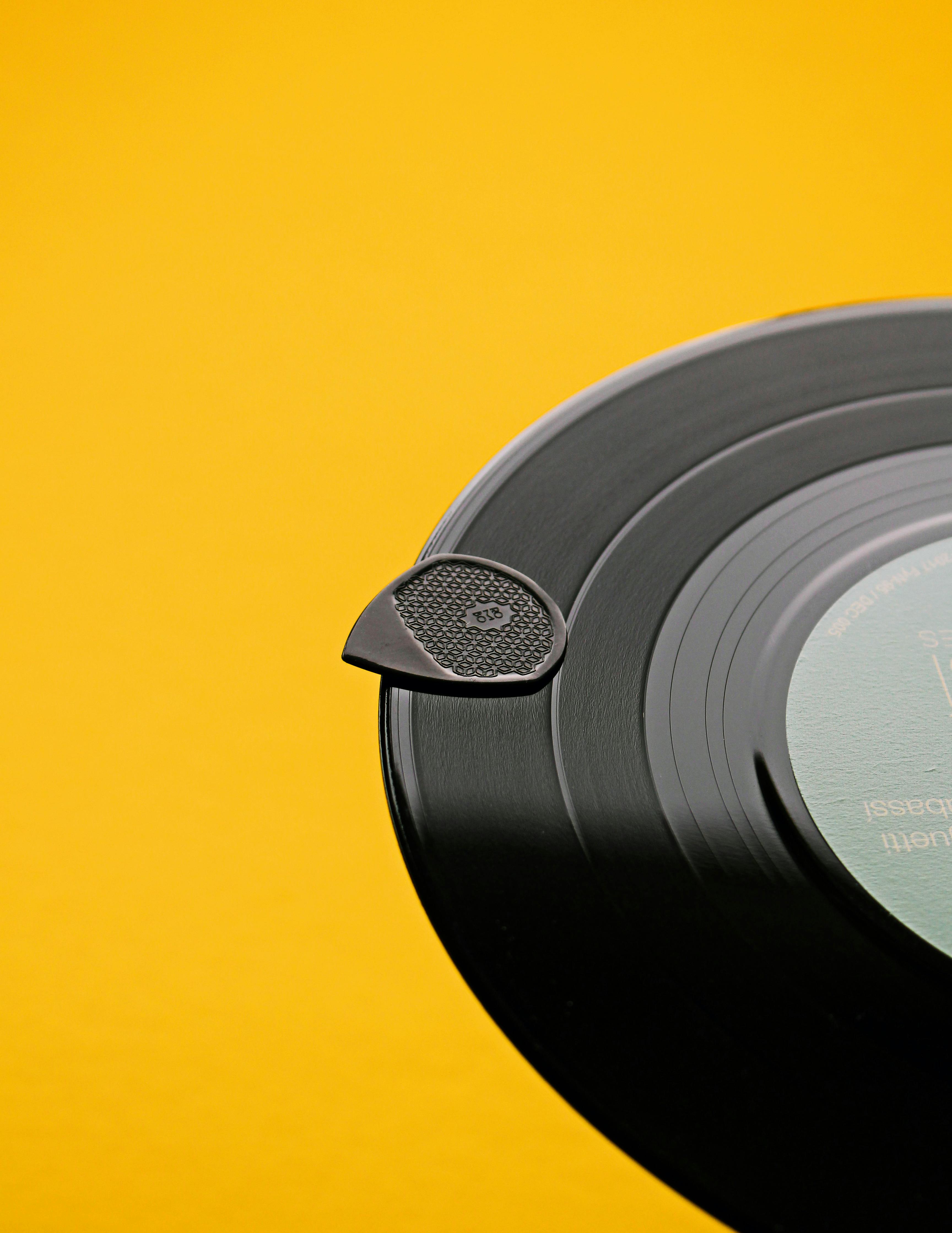 Guitar Pick on Vinyl Disk · Free Stock Photo