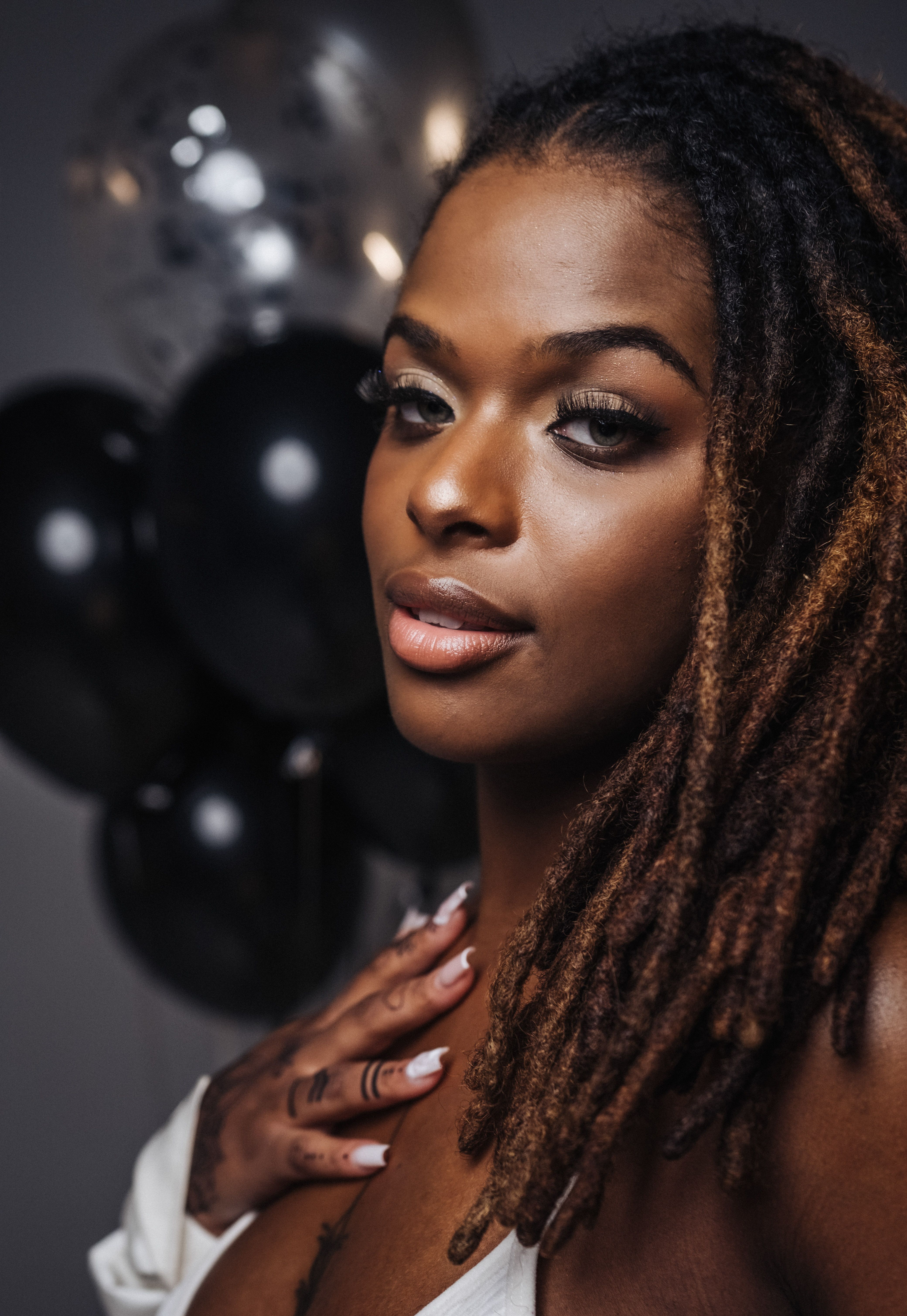 A woman with dreadlocks posing for a photo · Free Stock Photo