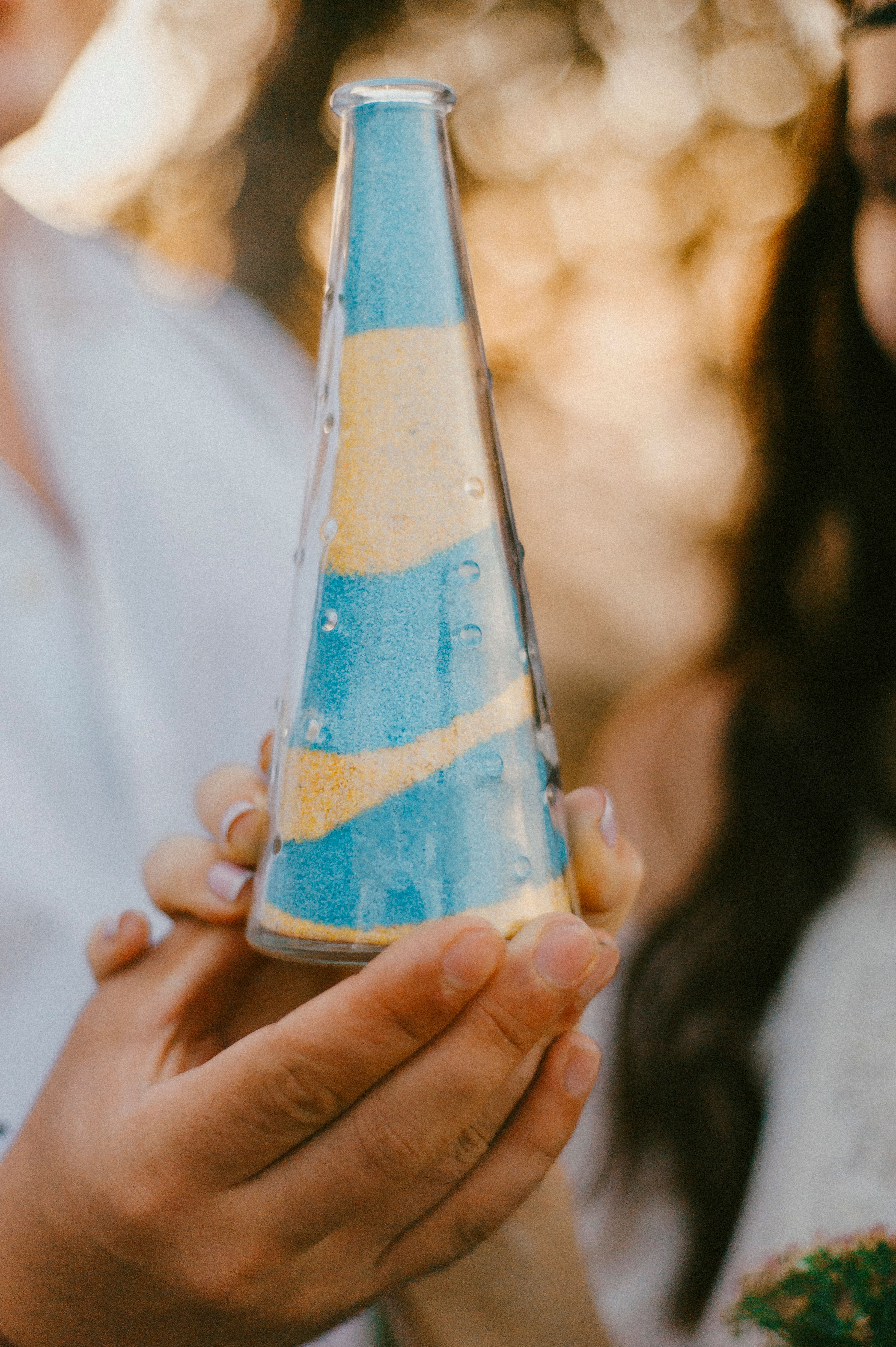 Yellow and Blue Sand in Glass Vase · Free Stock Photo