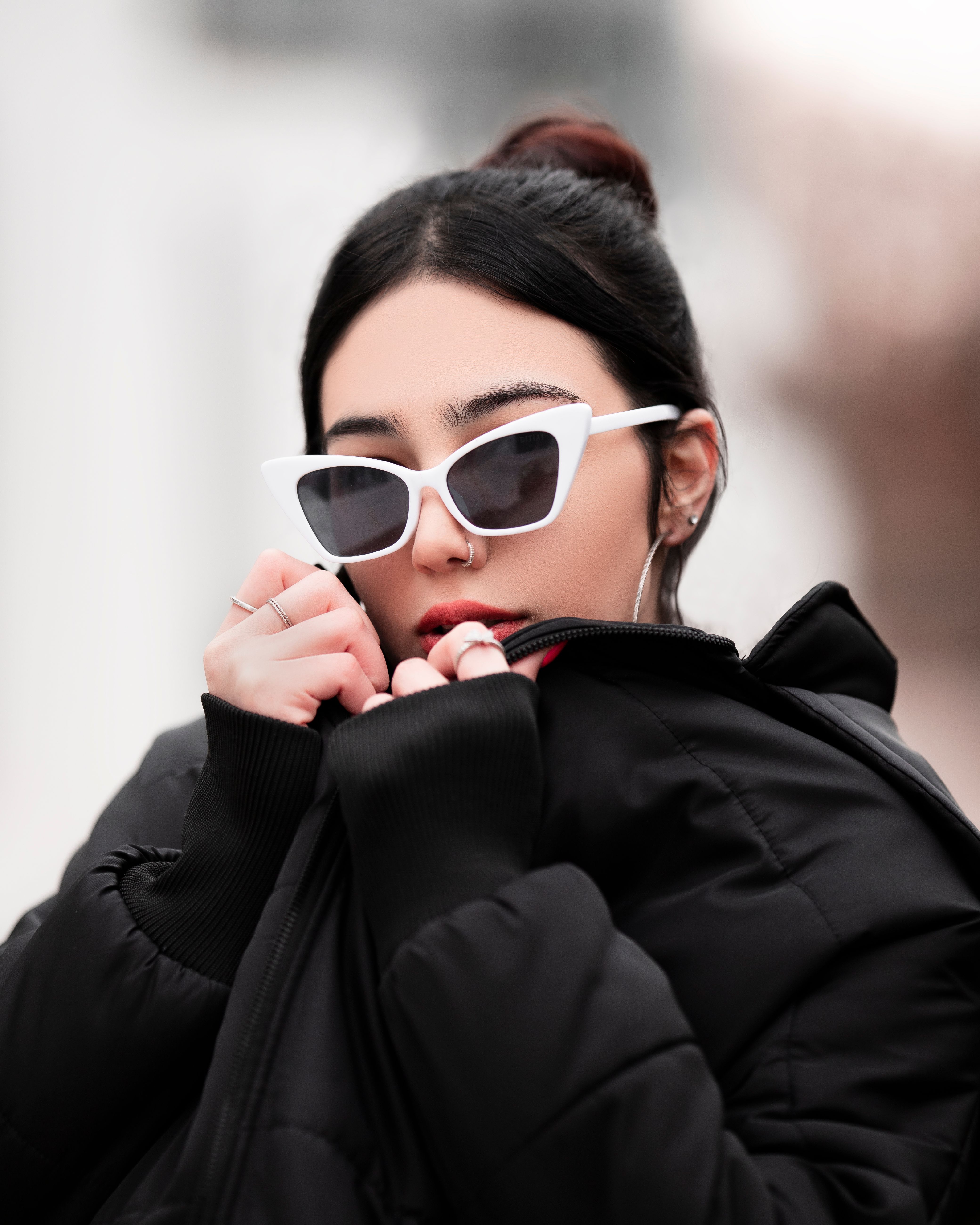 A Woman Undressing Her Jacket · Free Stock Photo