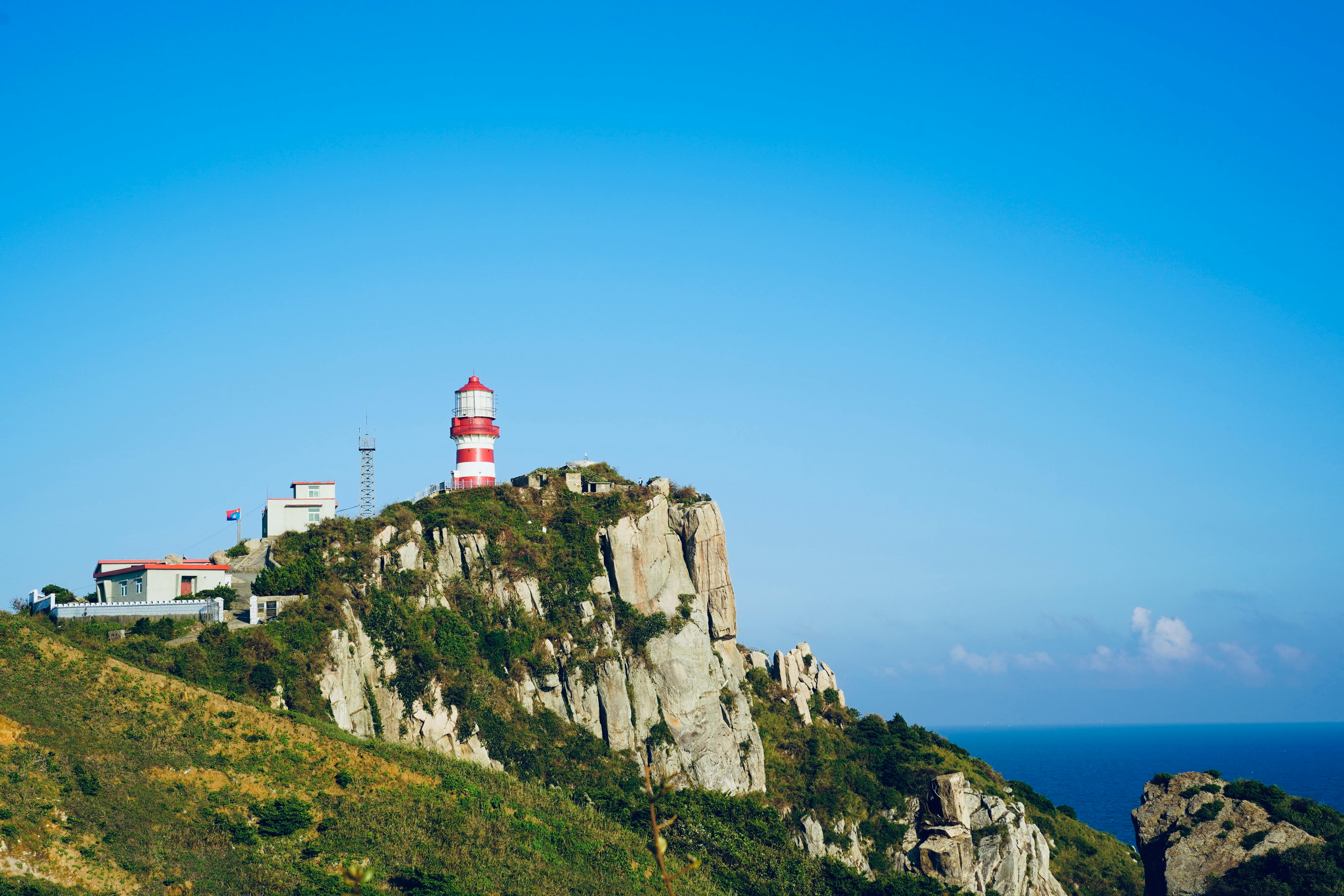 Lighthouse on Top of Cliff · Free Stock Photo