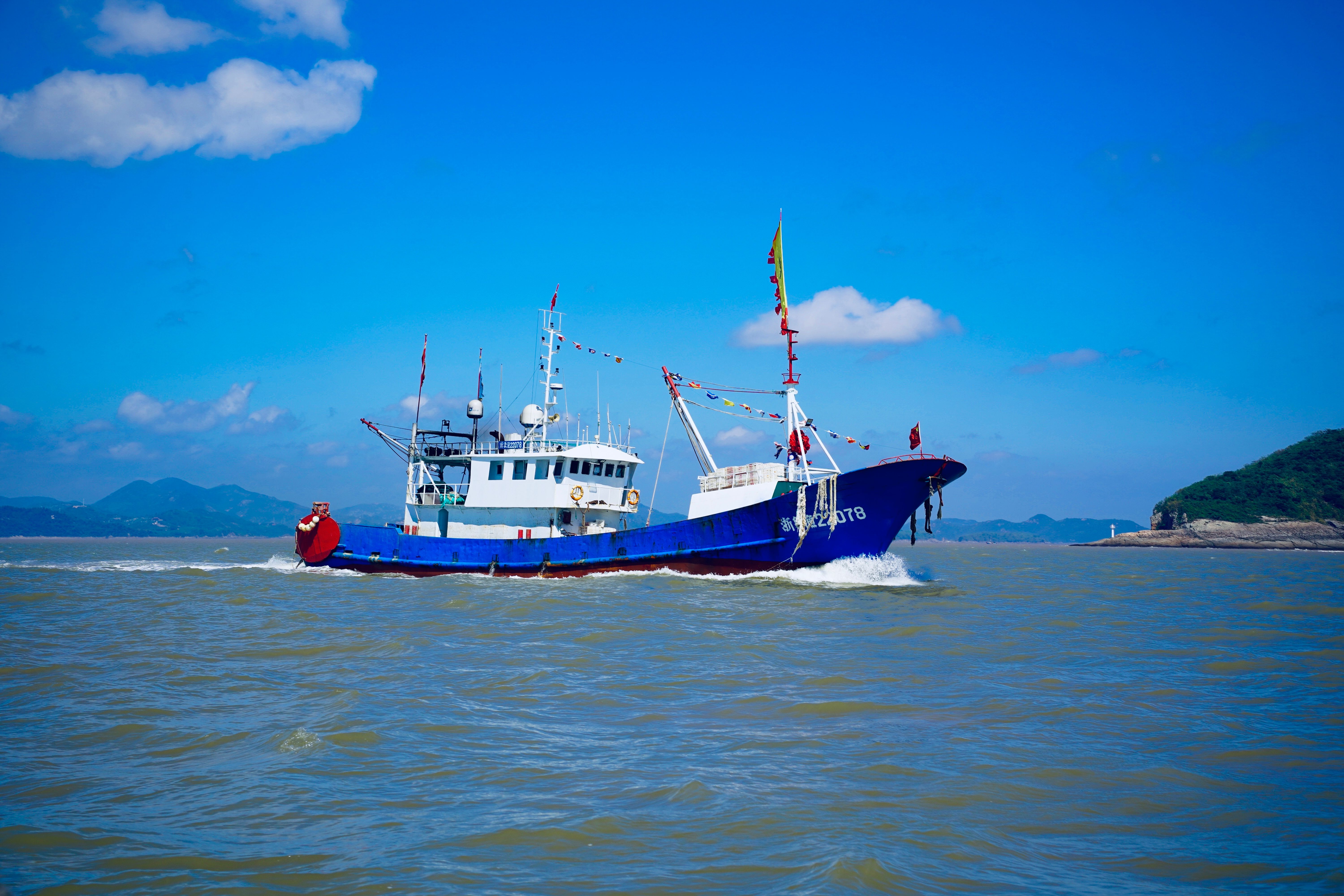 Fishing Boat Cruising the Sea · Free Stock Photo