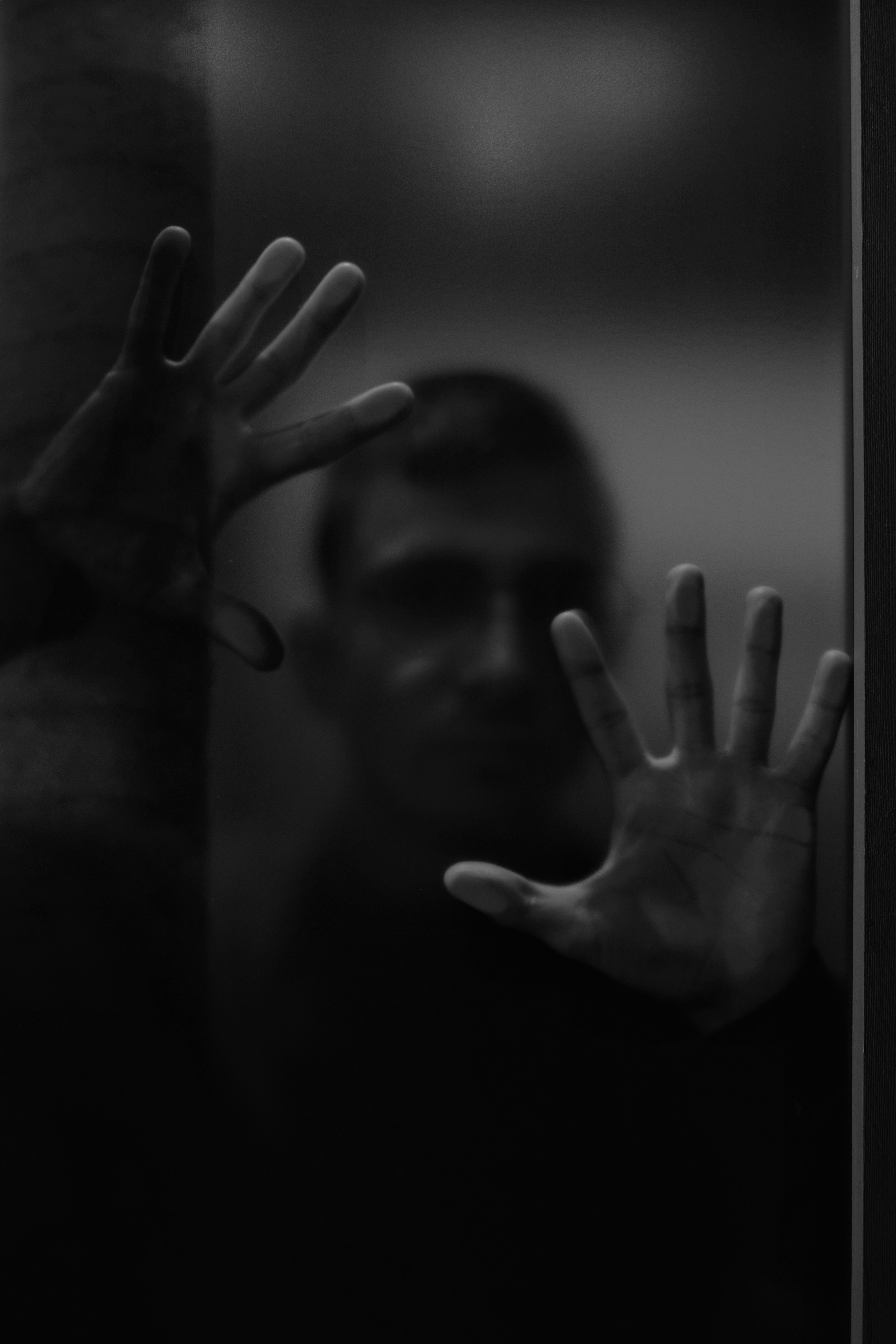 Two People Standing behind the Glass · Free Stock Photo