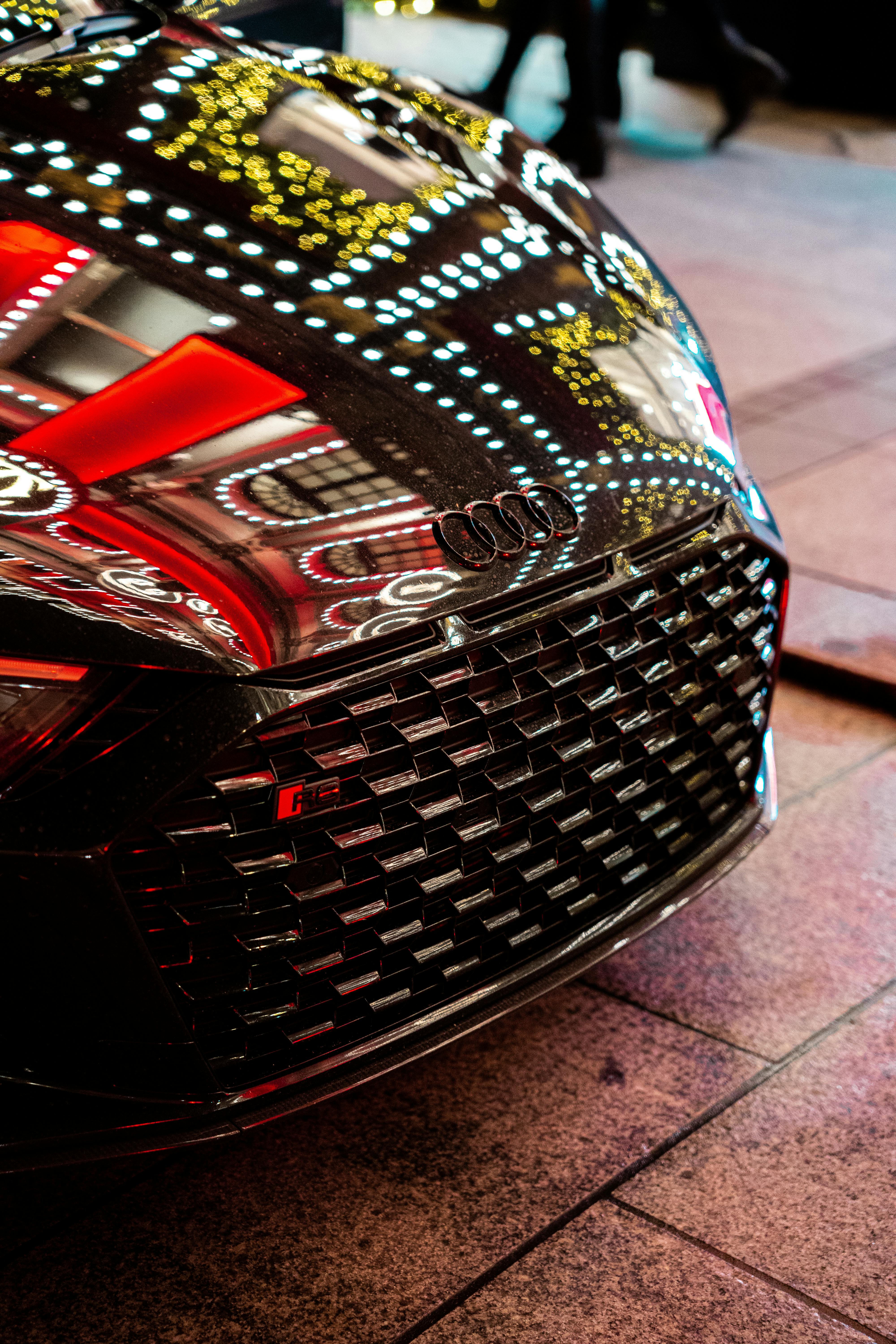 Close-up of an Audi R8 Reflecting the Lights on the Hood · Free Stock Photo