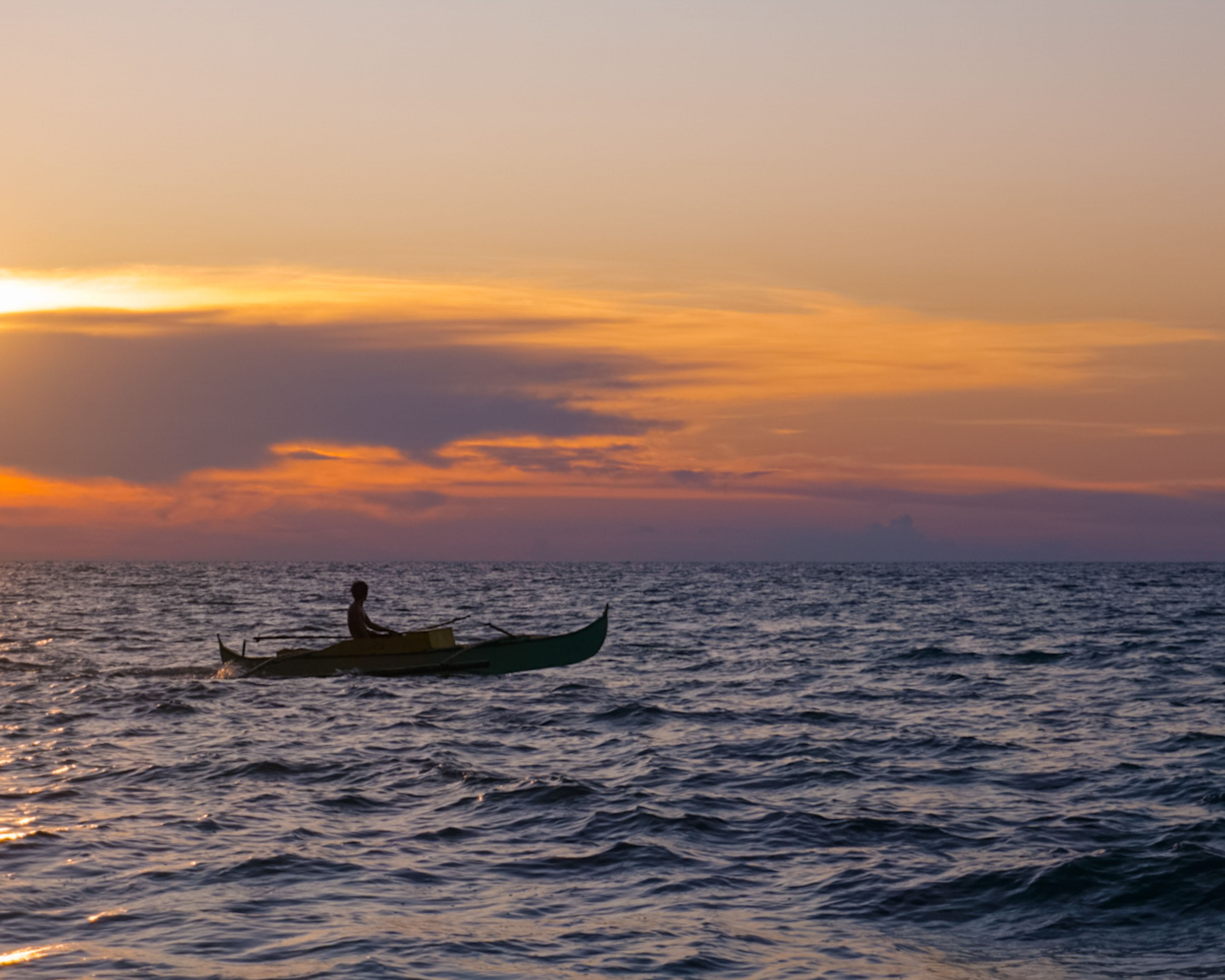 2 People on a Boat during Sunset · Free Stock Photo