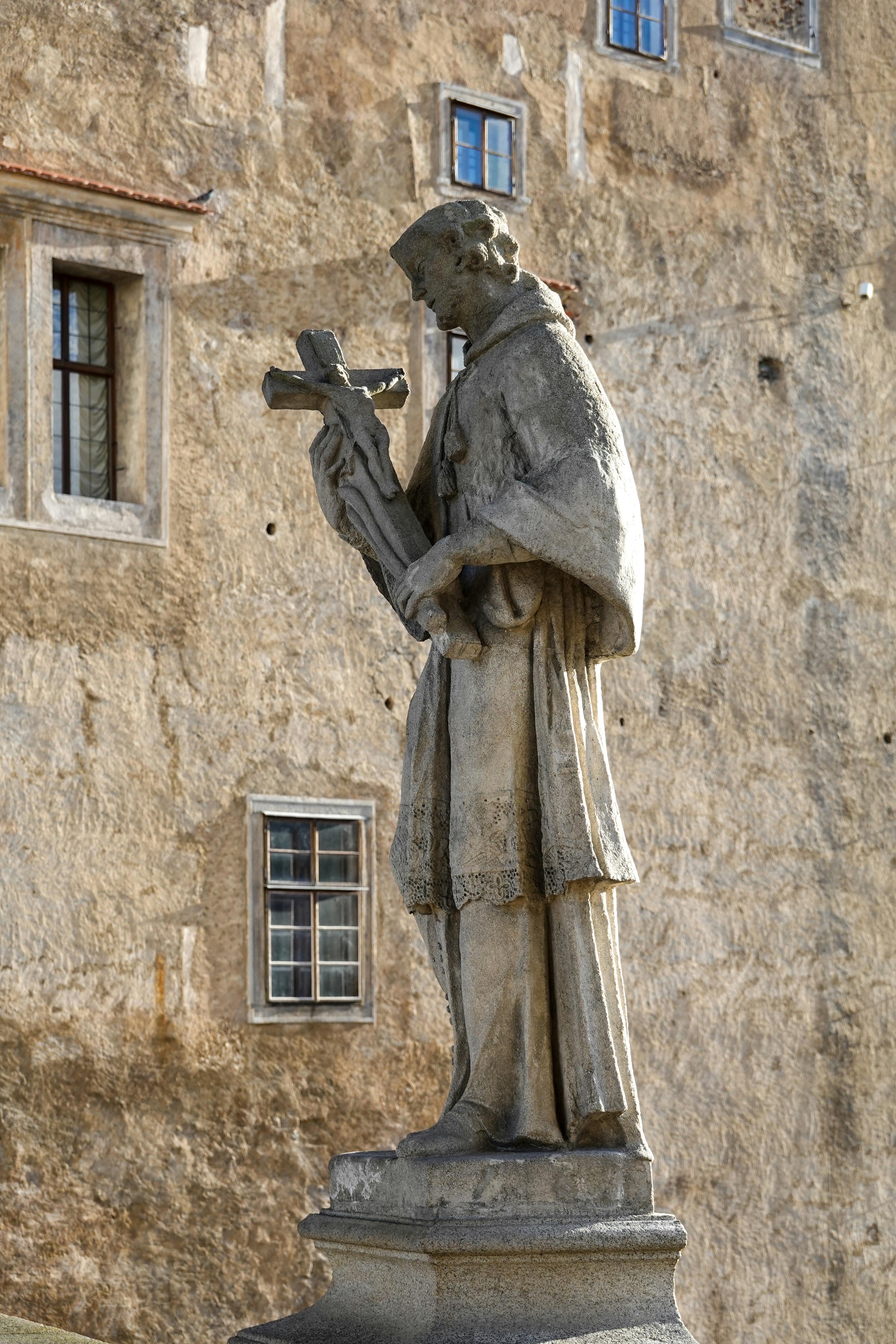 Statue of a Saint with Cross in His Arms in Cesky Krumlov, Czech ...