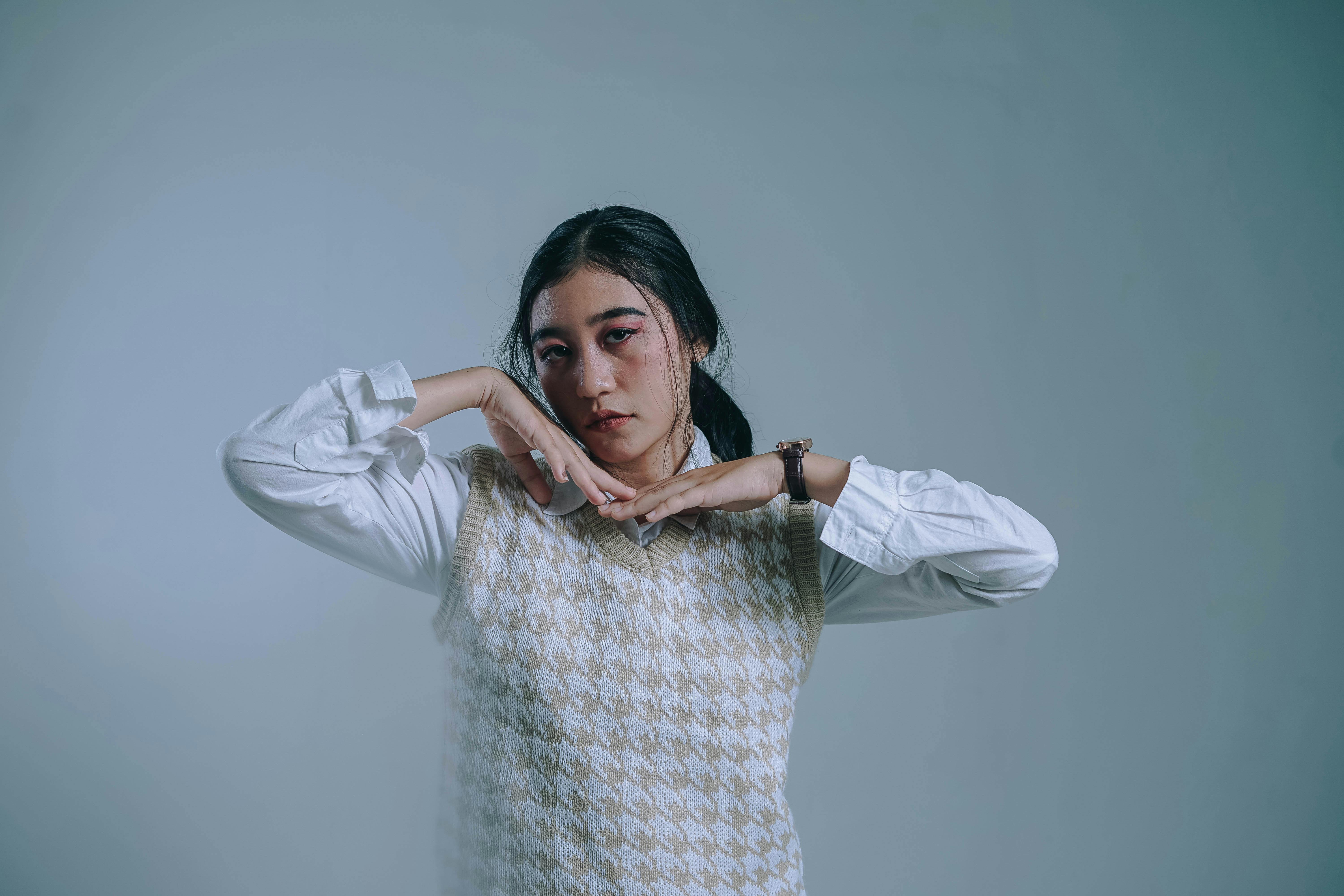 Portrait of Woman Standing with Hands under Face · Free Stock Photo
