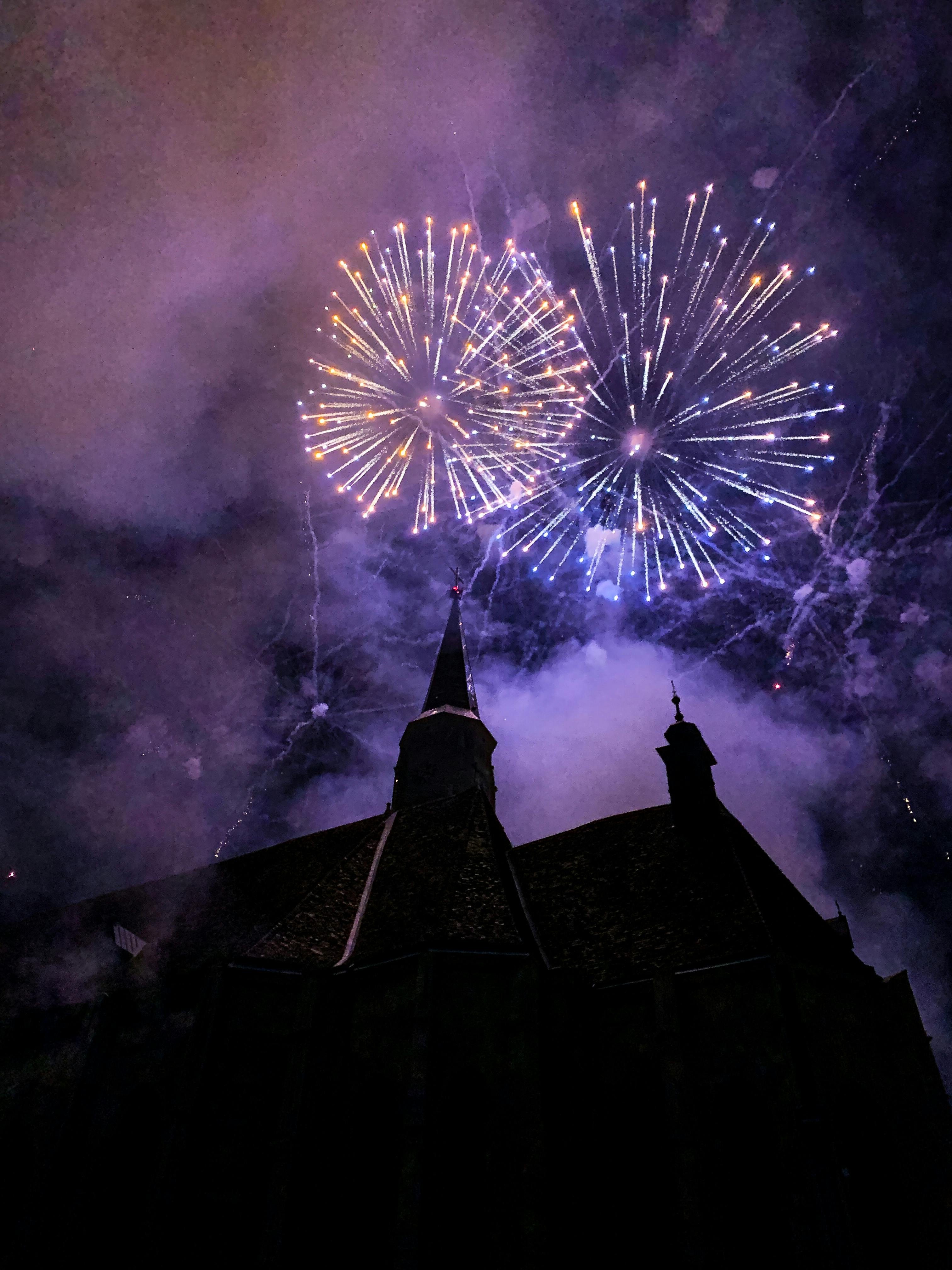 Fireworks over a church in the night sky · Free Stock Photo