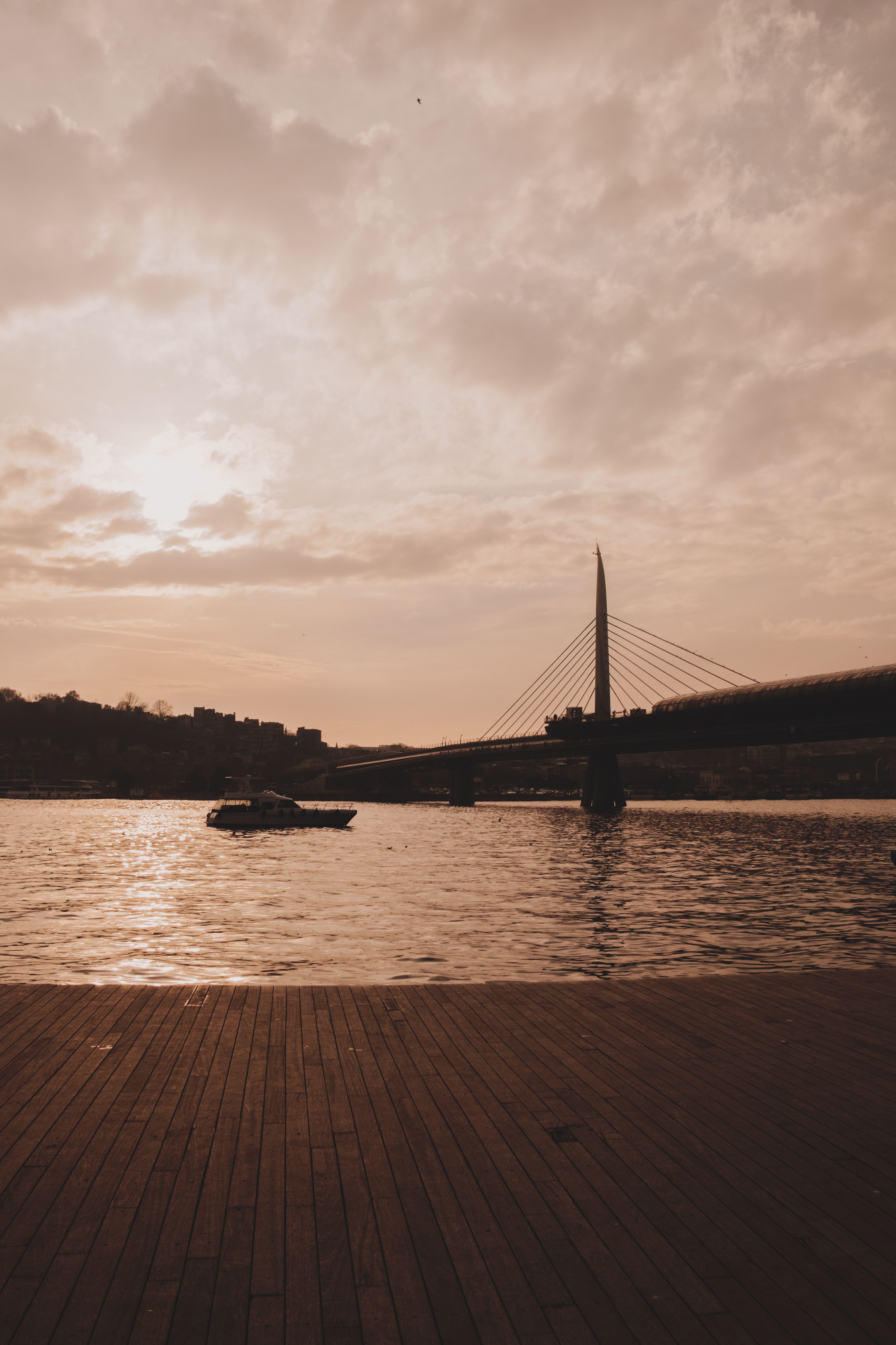 Sepia Toned Photograph of a River with a Suspension Bridge · Free Stock ...
