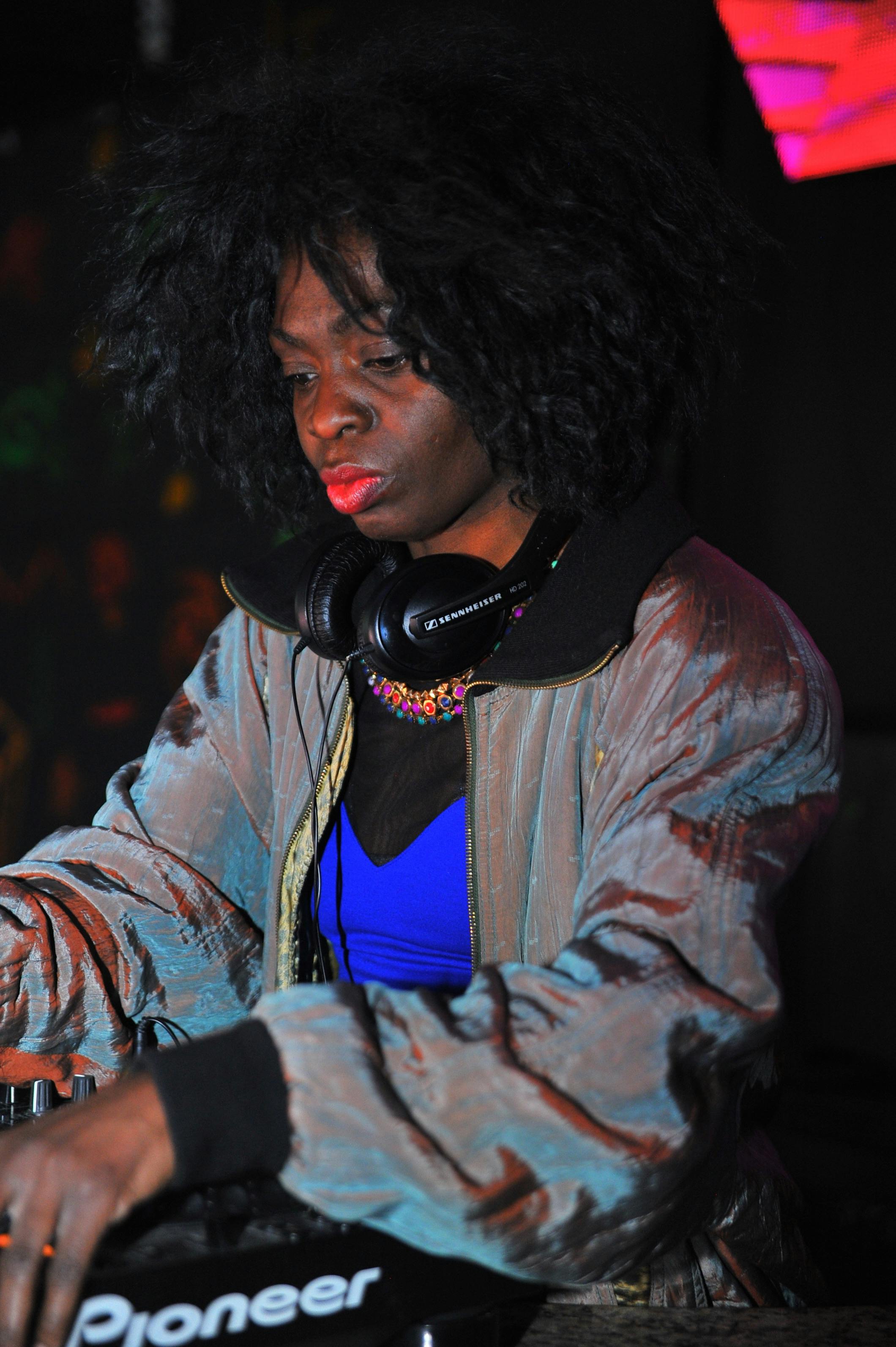 African Woman Playing DJ Set in a Club · Free Stock Photo