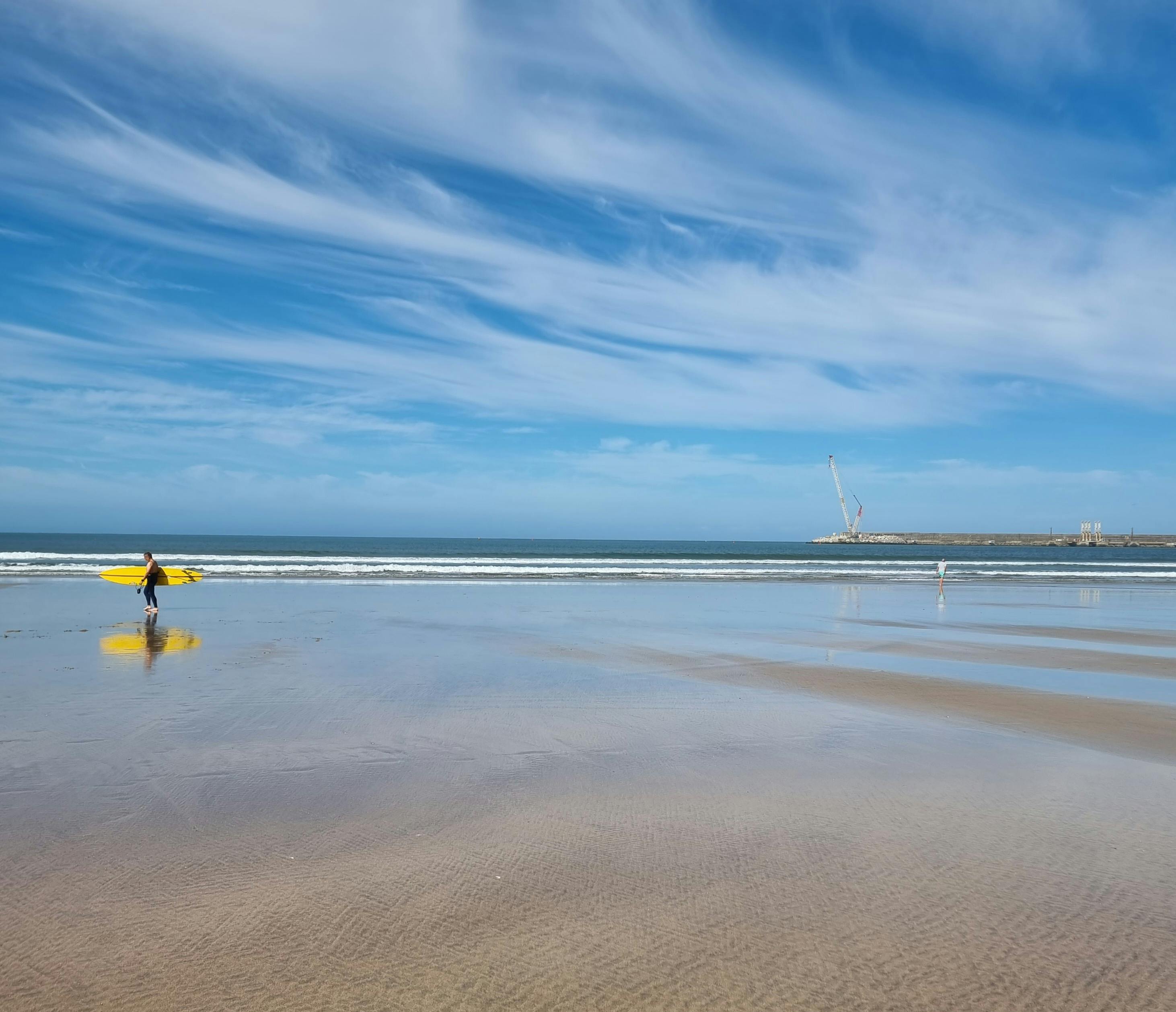 Person Carrying Lights on Shore · Free Stock Photo