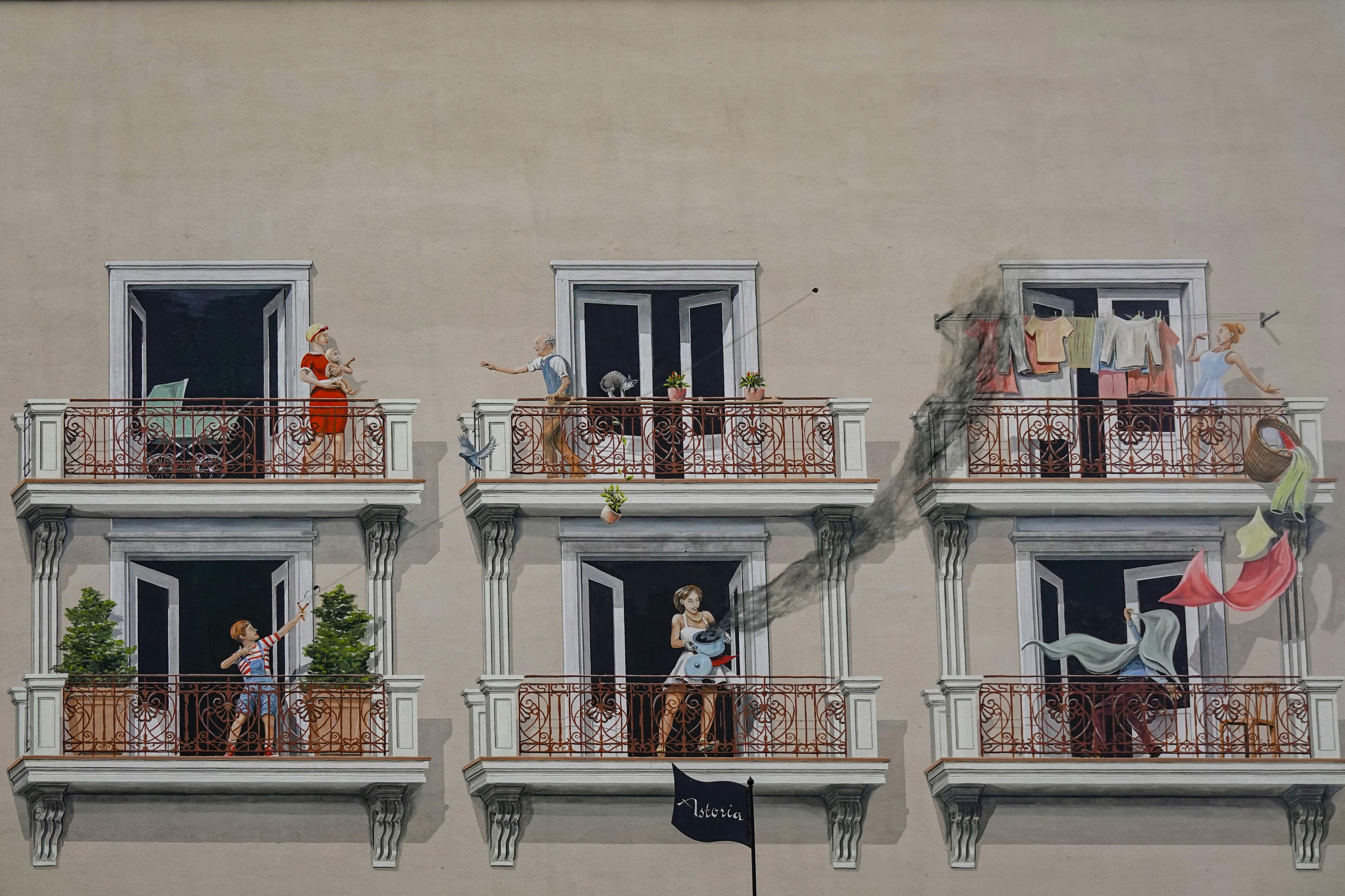 People on Balconies · Free Stock Photo