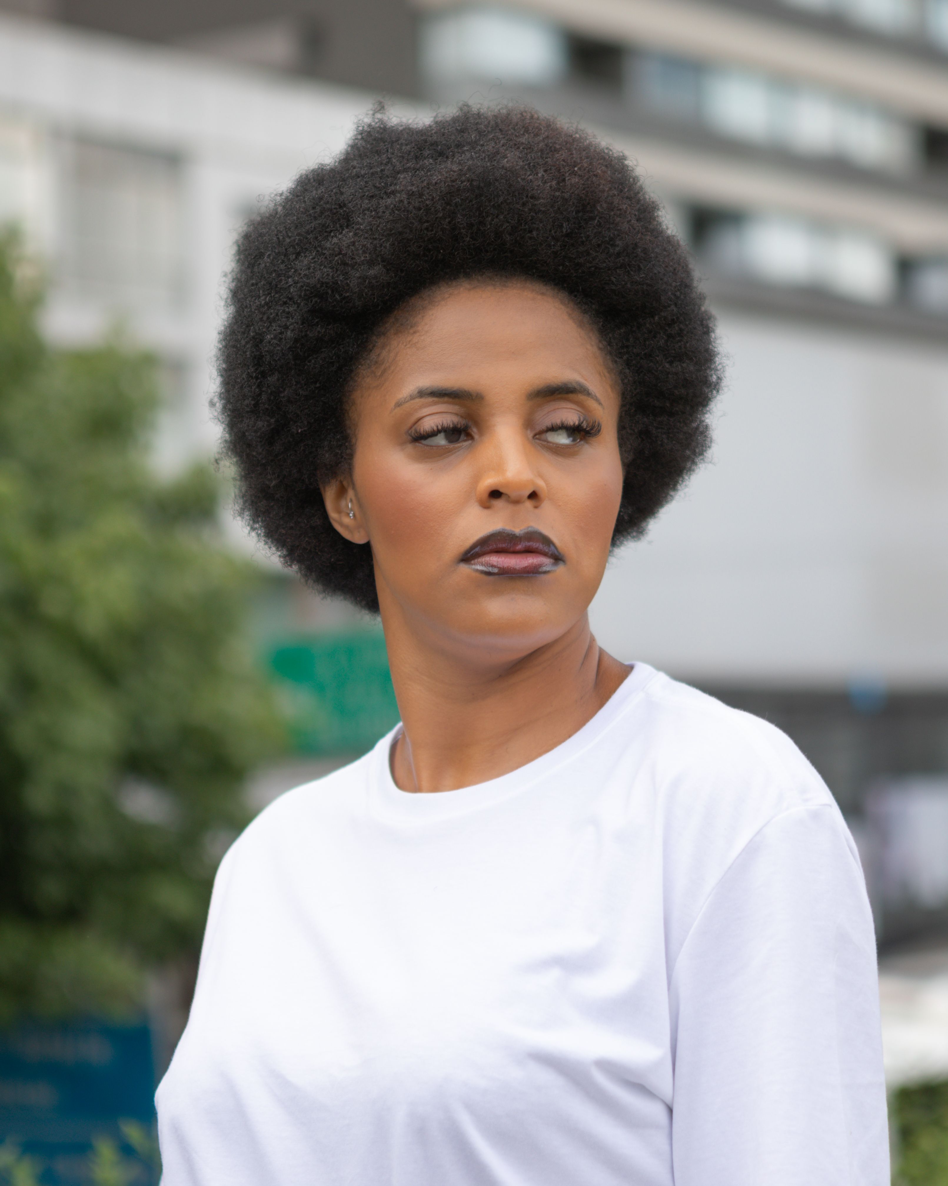 Close-up of a Woman with Afro Hair · Free Stock Photo