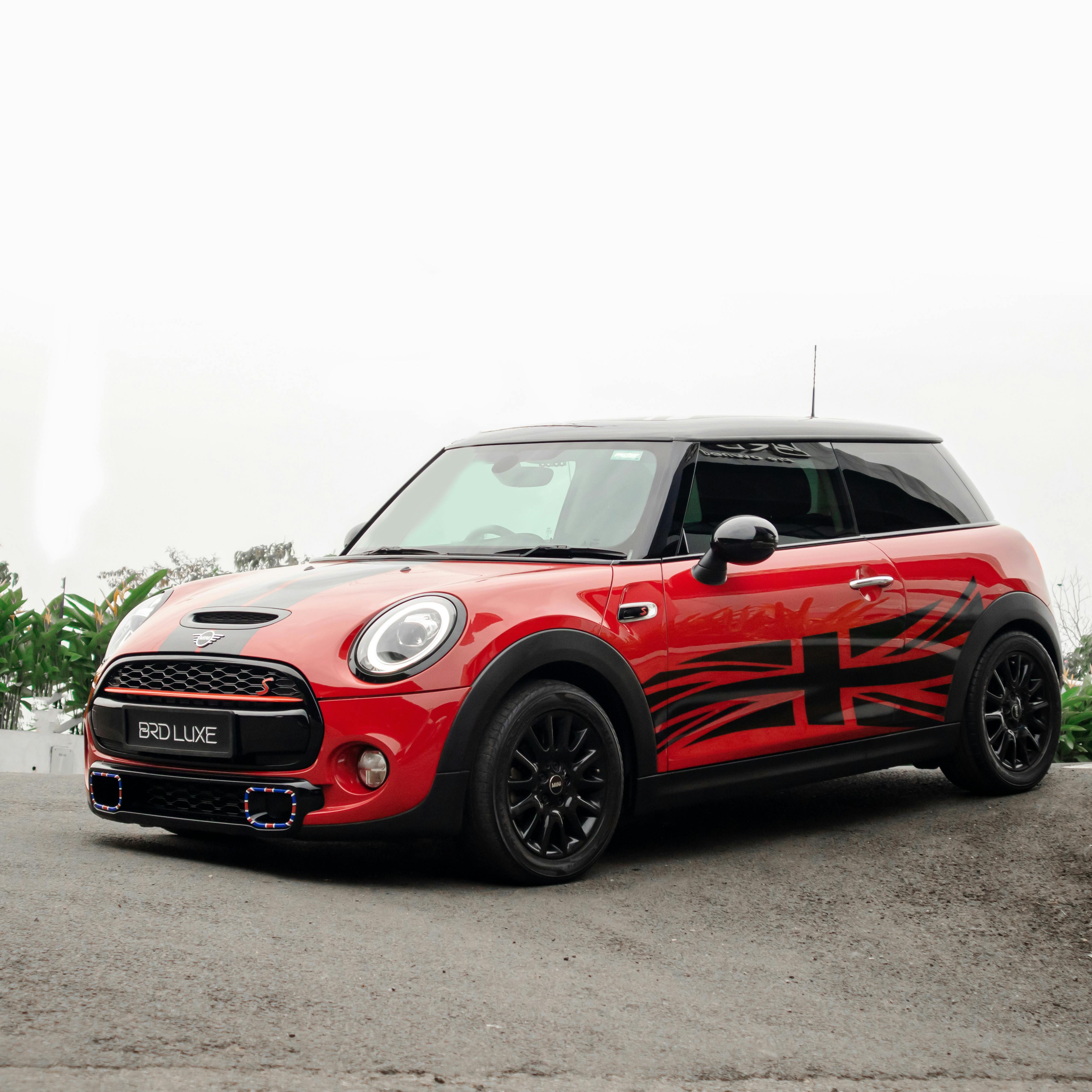 A Red and Black Mini Cooper Parked on the Street · Free Stock Photo