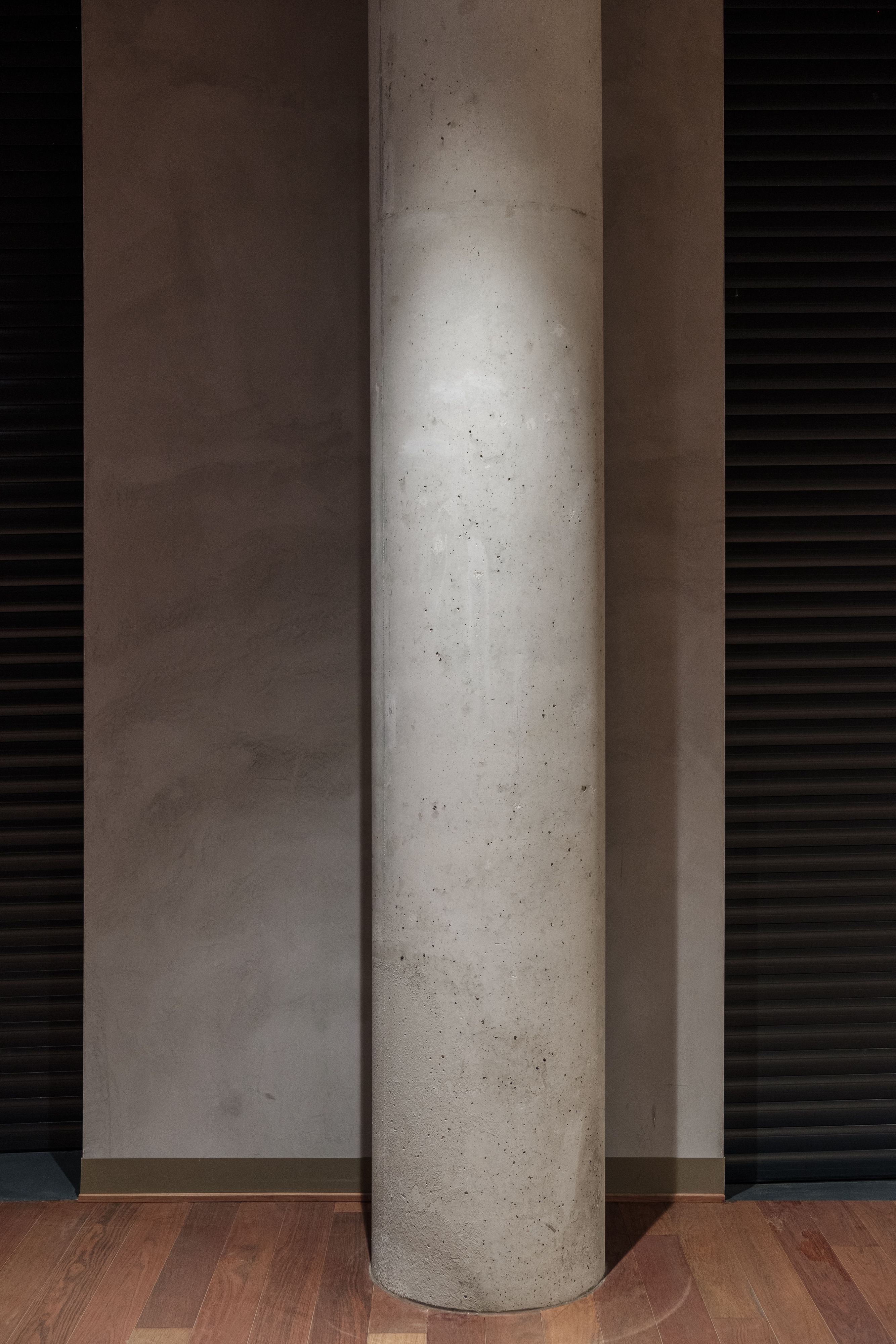 Concrete Column on Wooden Floor · Free Stock Photo