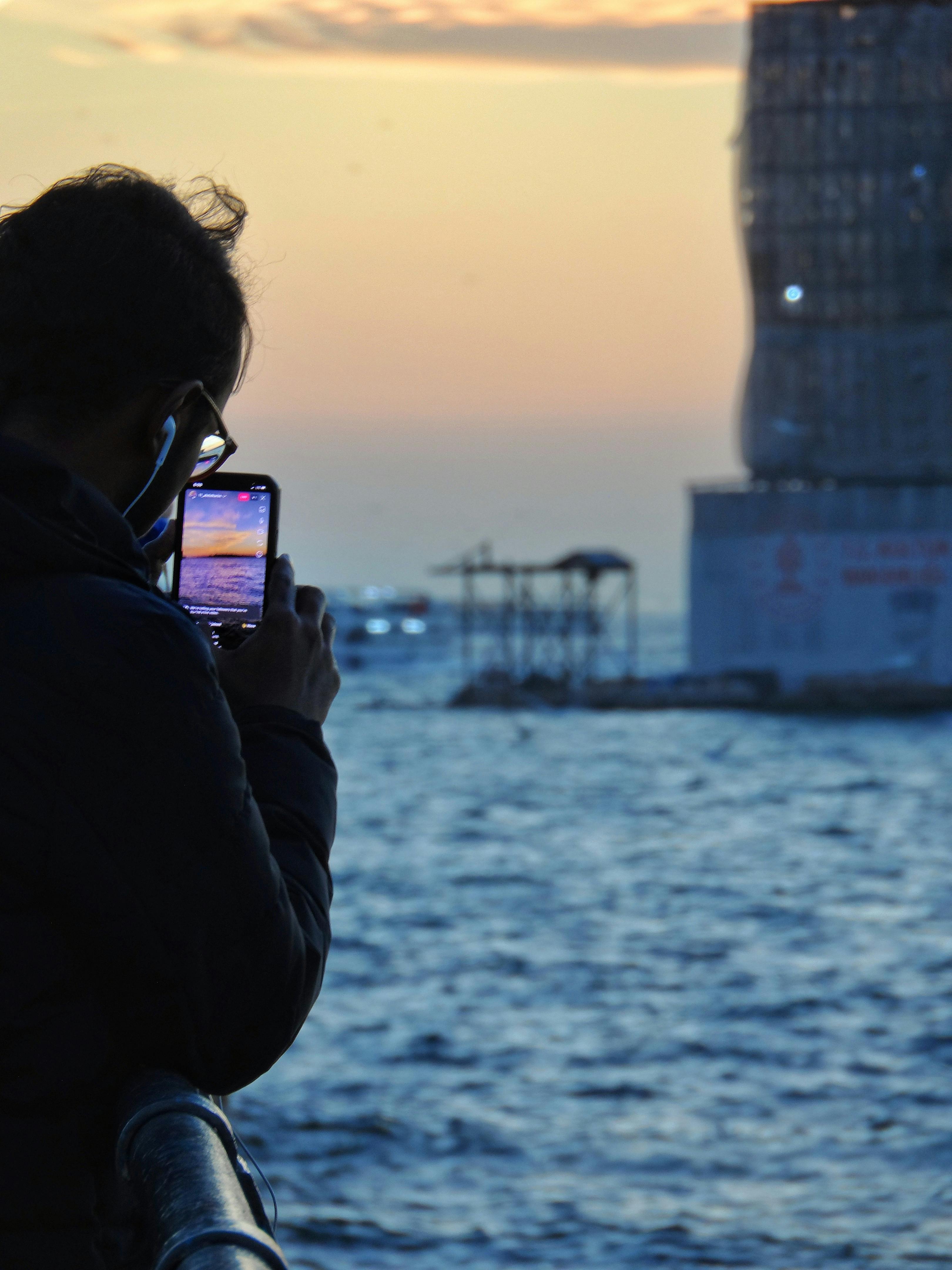 Man Taking Photo with Smart Phone · Free Stock Photo