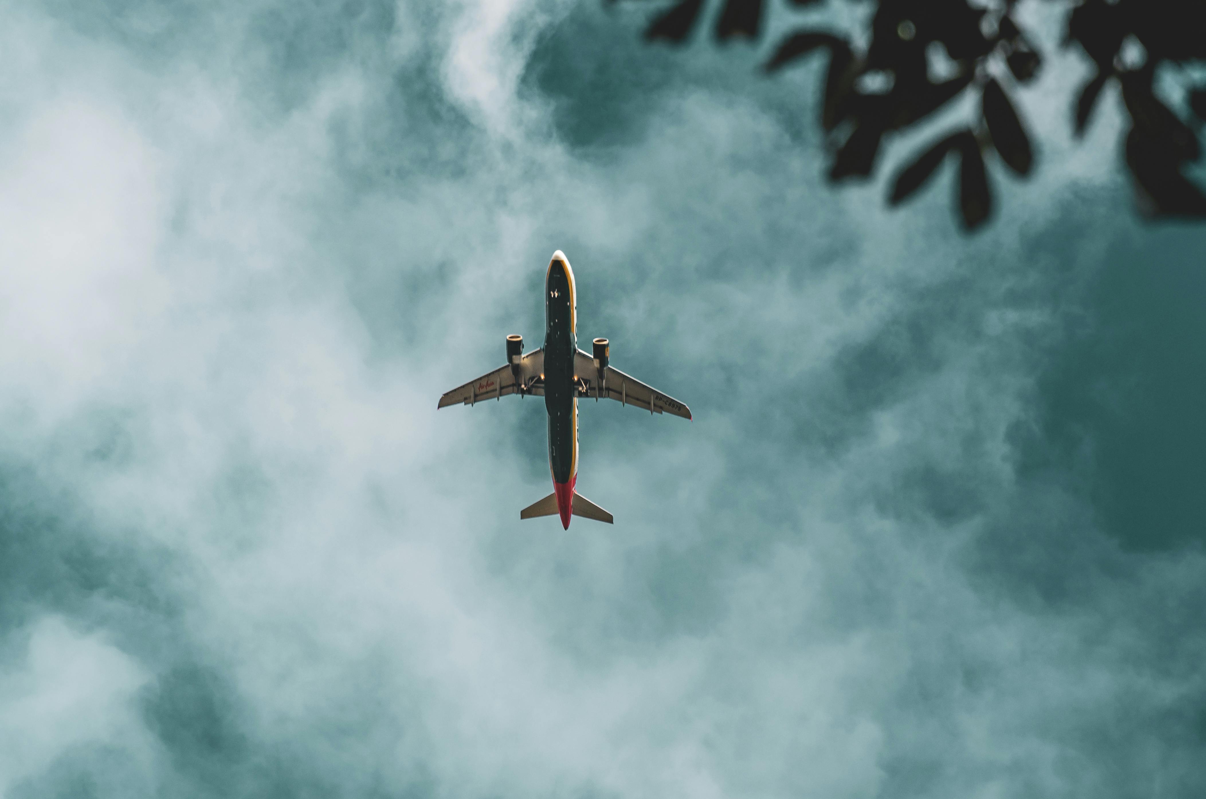Mountains and Clouds Outside of an Airplane Window · Free Stock Photo