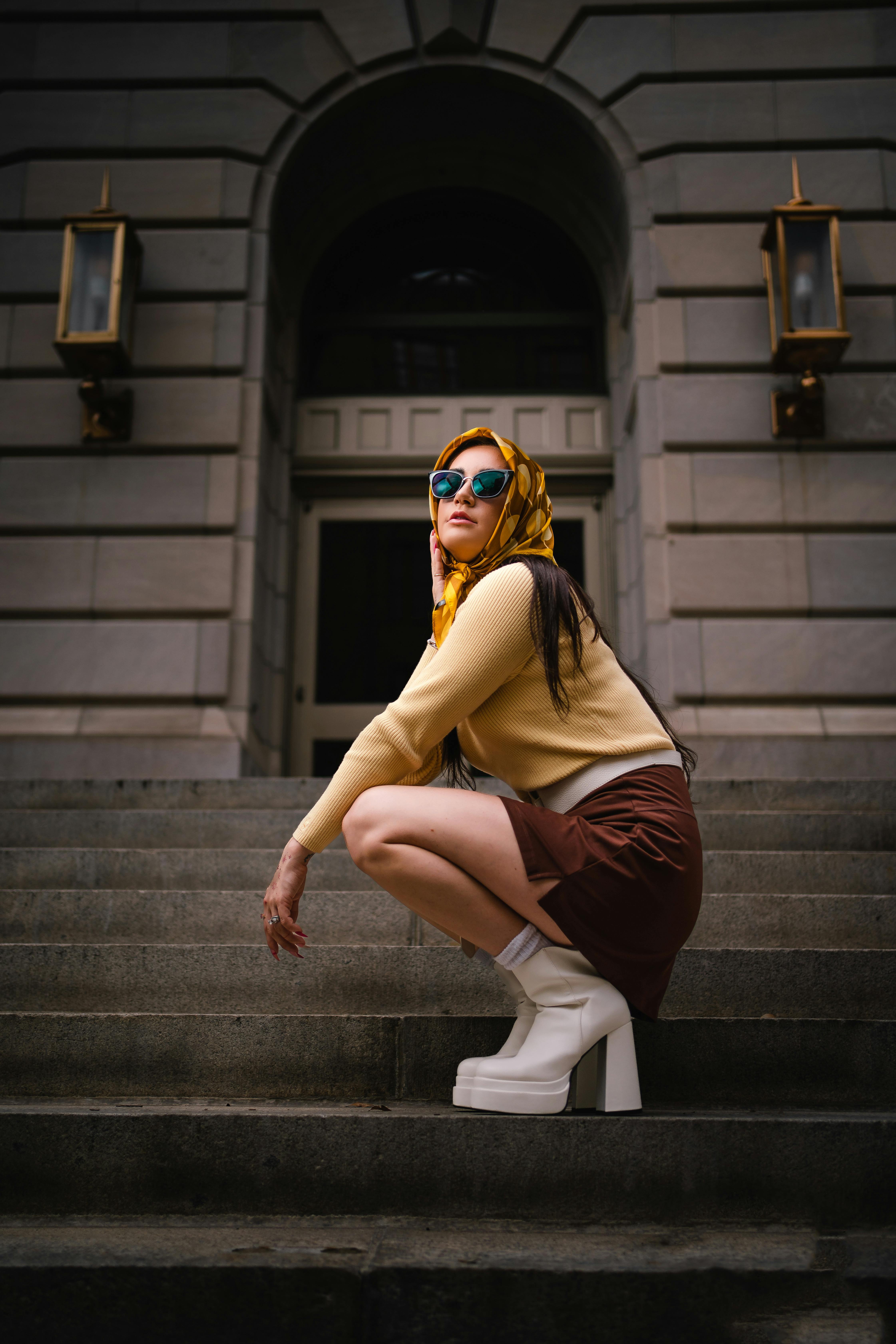 Woman Crouching on Stairs and Posing · Free Stock Photo