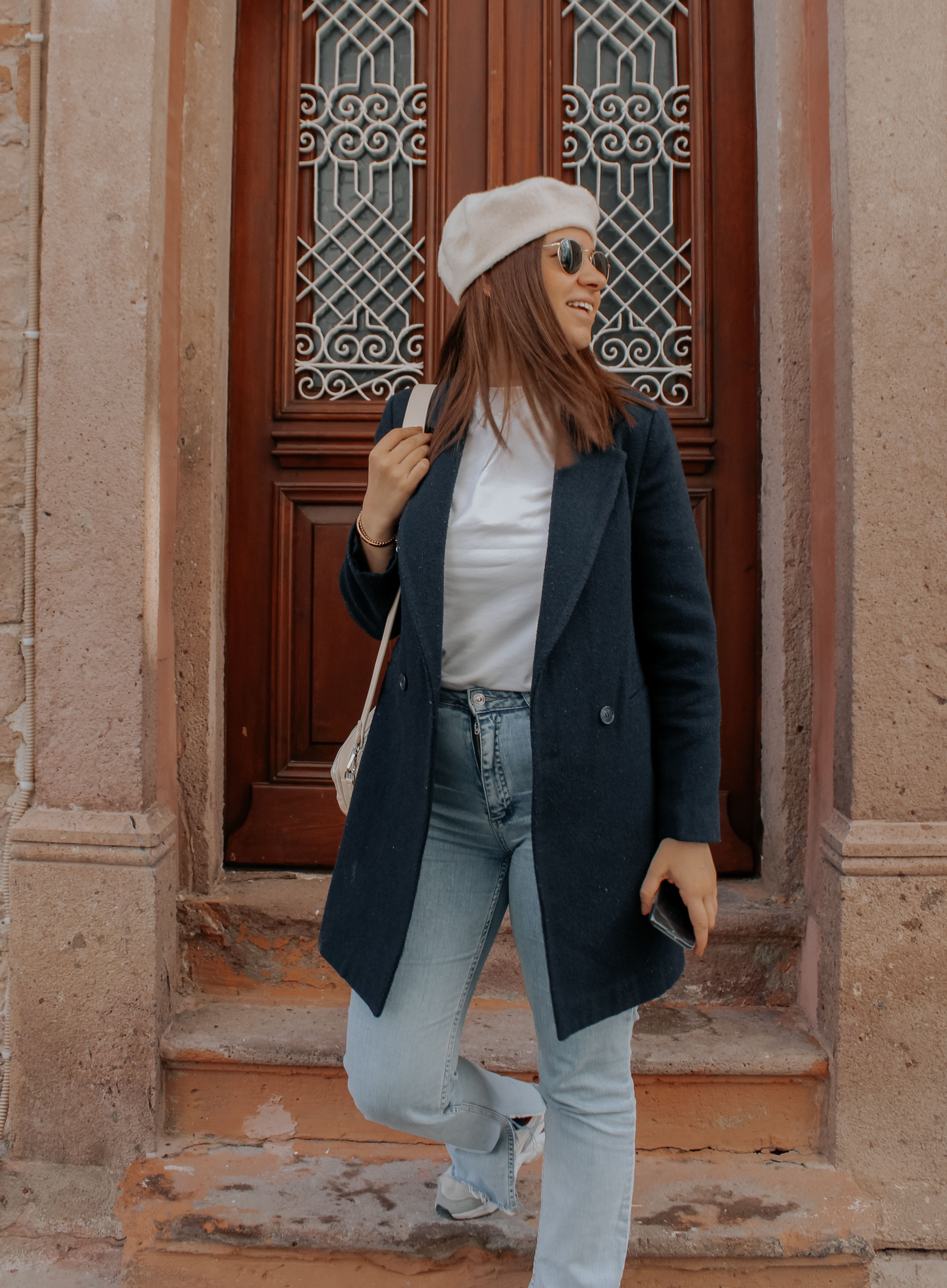 Beautiful Woman in Black Long Coat Looking Sideways · Free Stock Photo