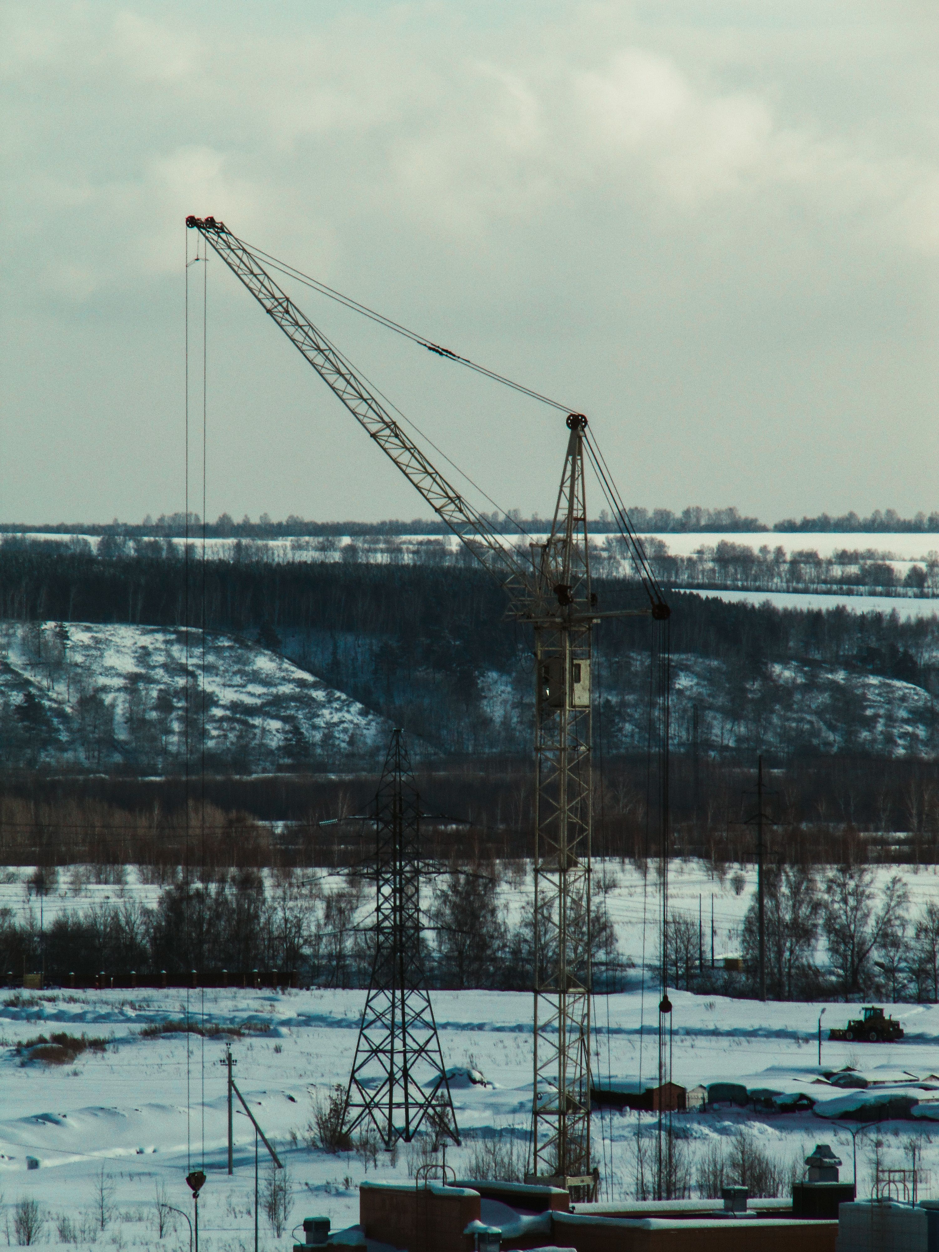 Tower Crane on Snow Covered Ground · Free Stock Photo