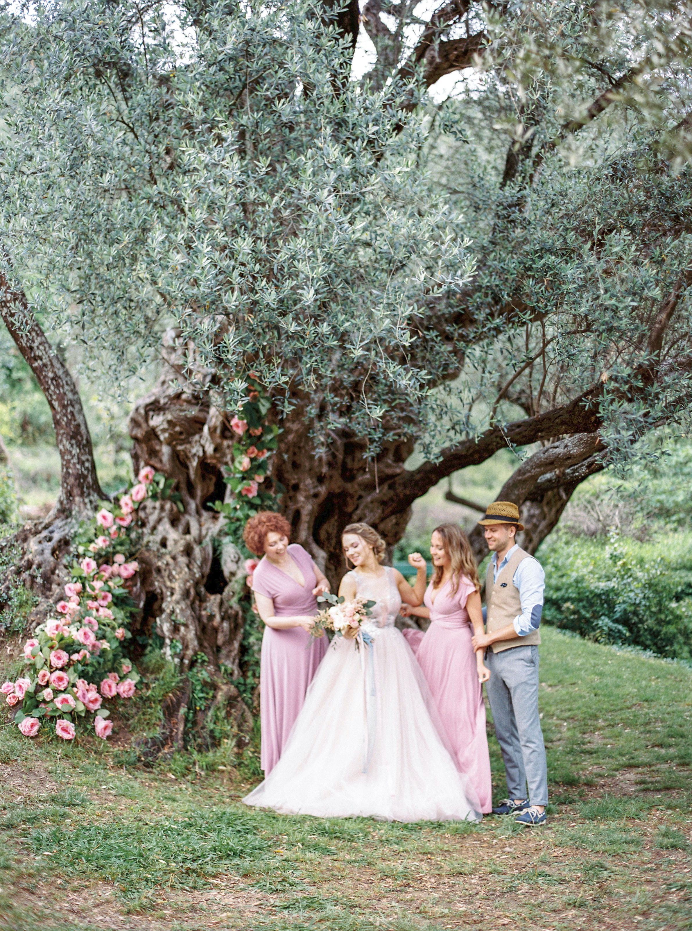 Bride with Family Standing under the Tree · Free Stock Photo