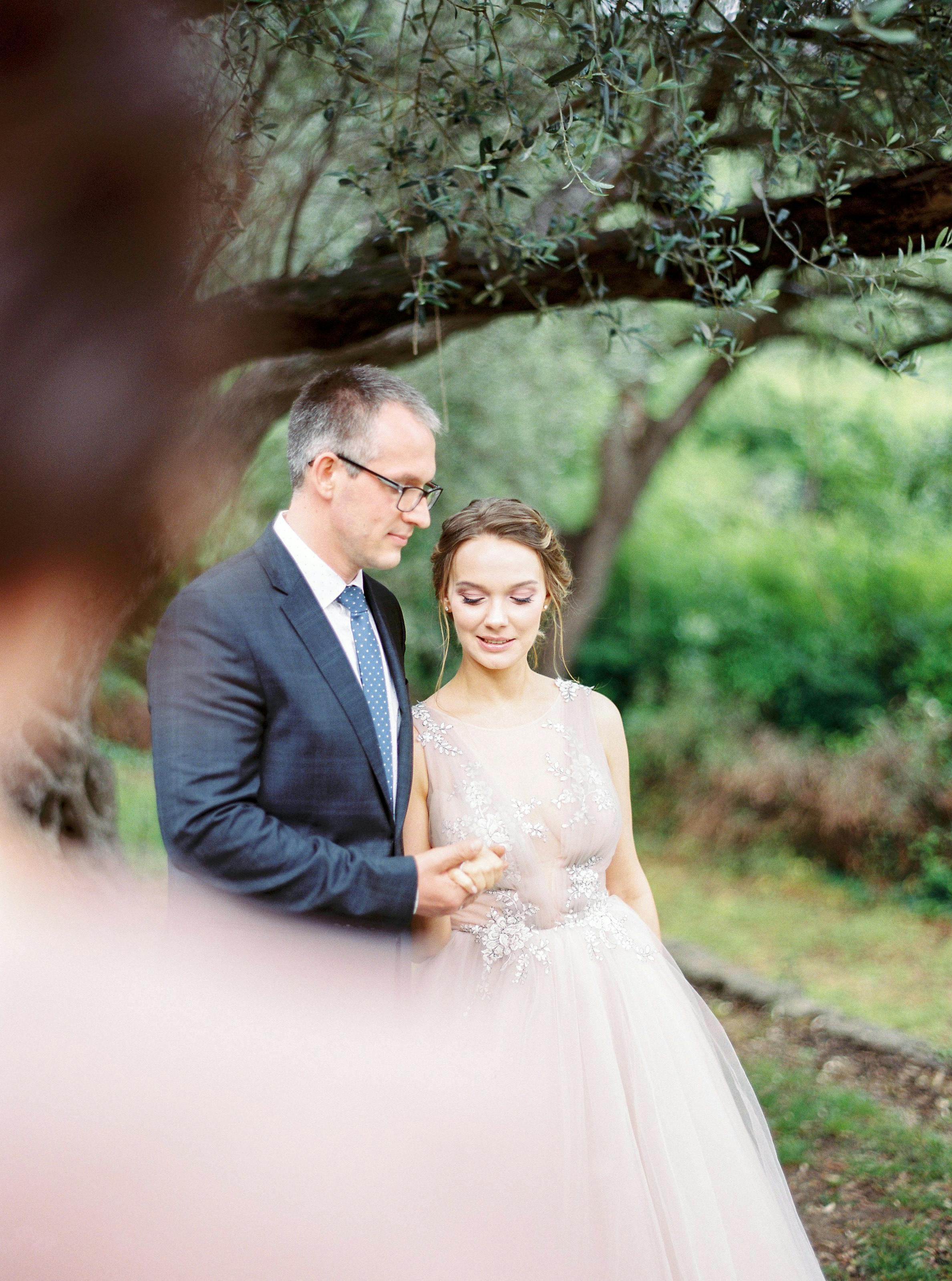 Photo of the Bride and Groom with Witnesses Standing in the Garden ...
